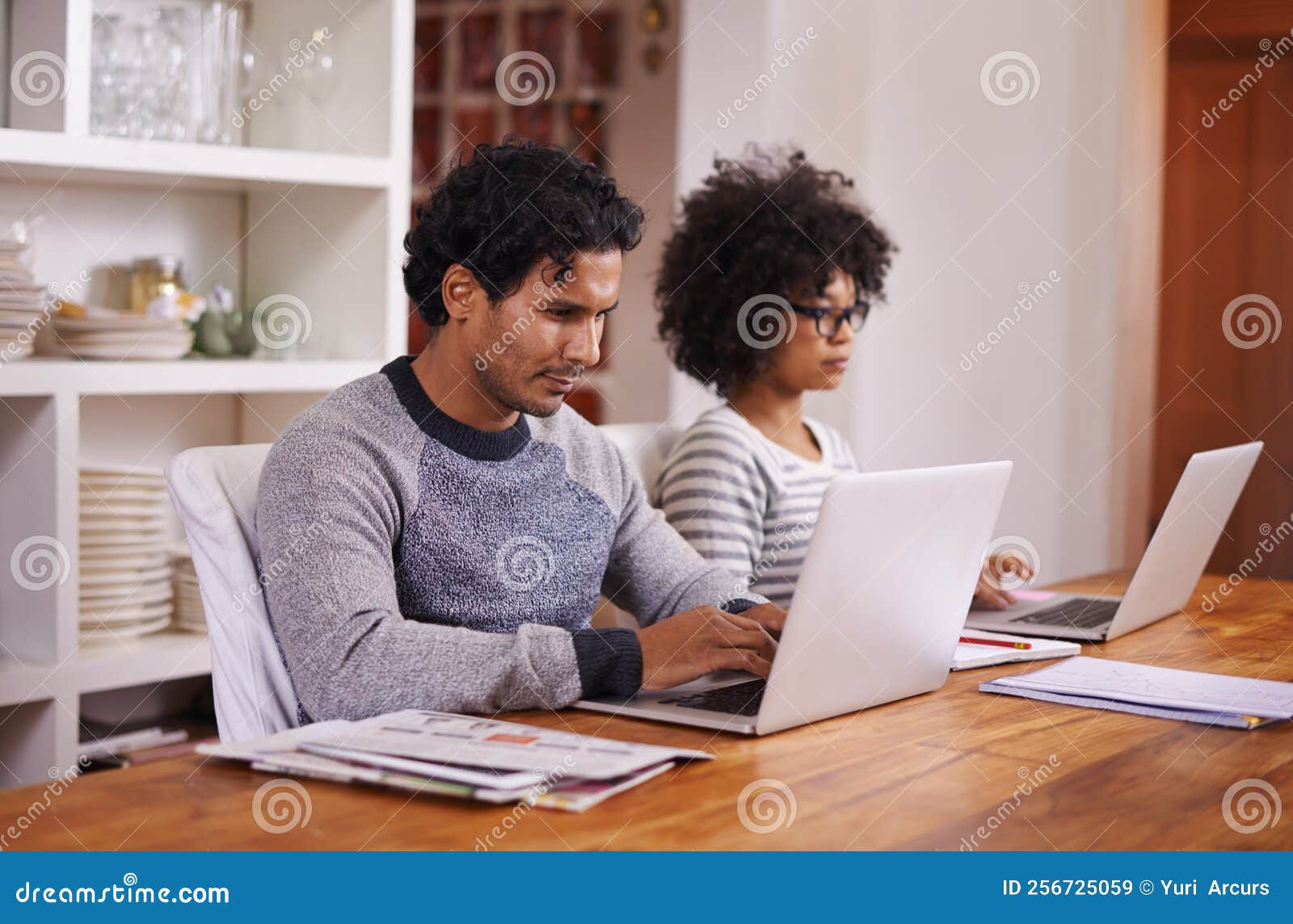 Home Admin Made Easy. a Young Couple Busy on Their Laptops at Home ...