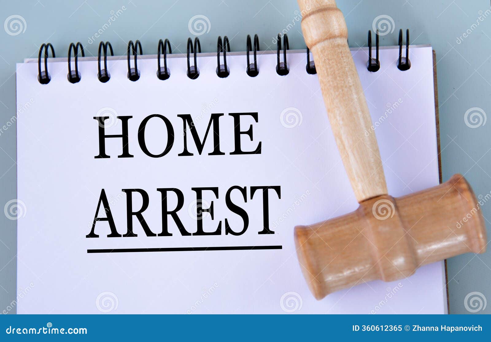 HOME ARREST - Words in a Notebook on a Gray Background with a Judge S ...