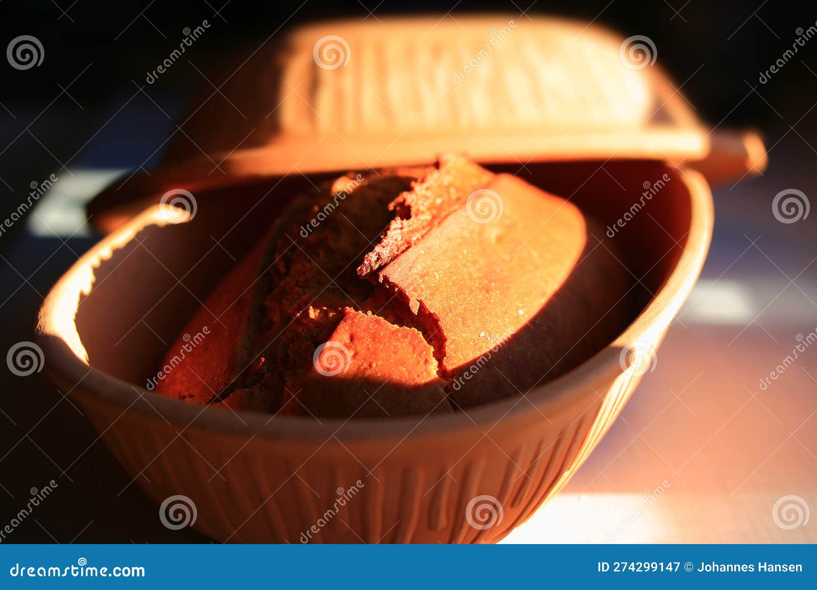 Home Baked Bread in a Traditional Clay Form with Warm Sunlight Stock ...