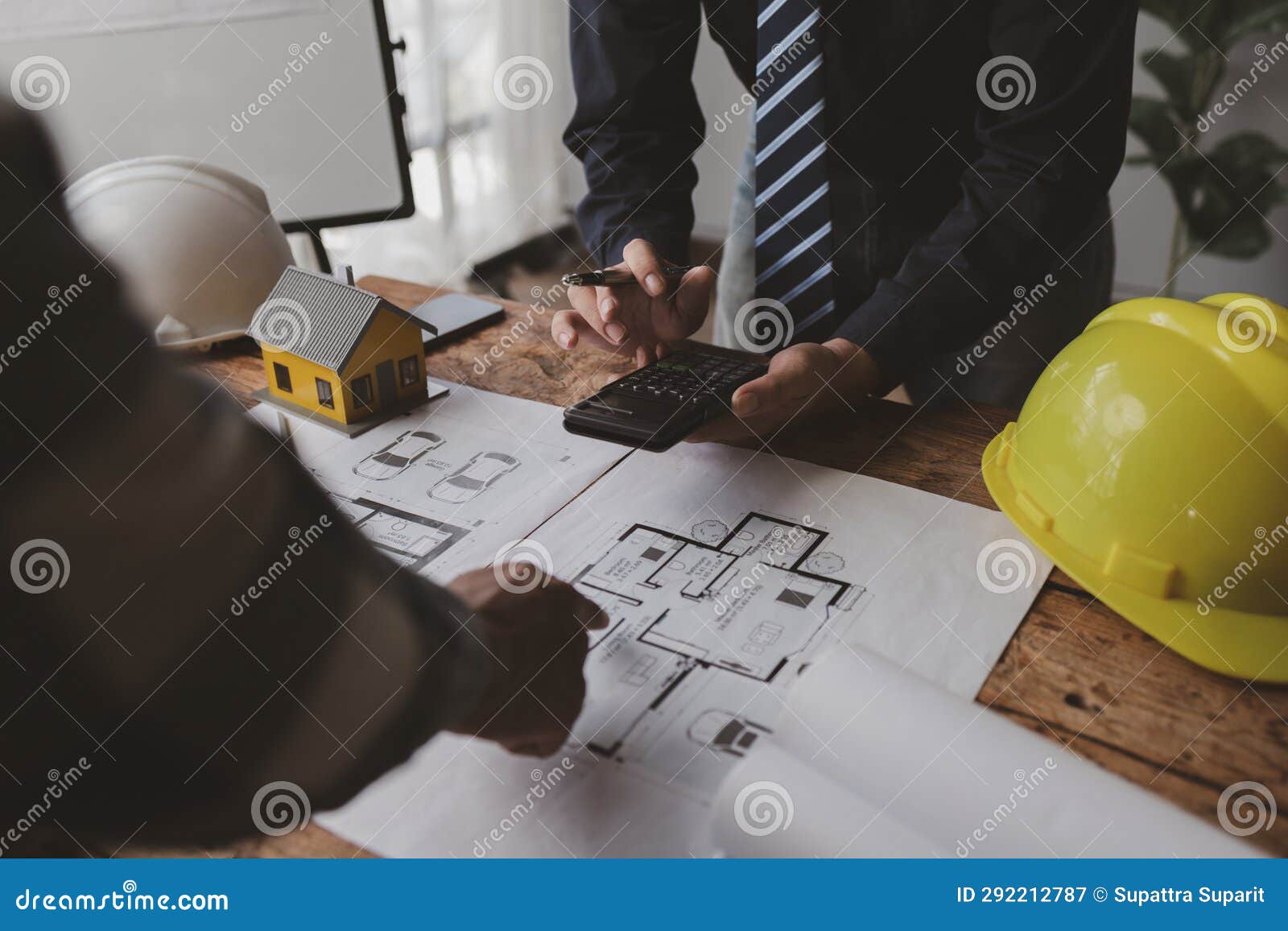 The Home Design Architects are Reviewing the House Plan Draft, the ...