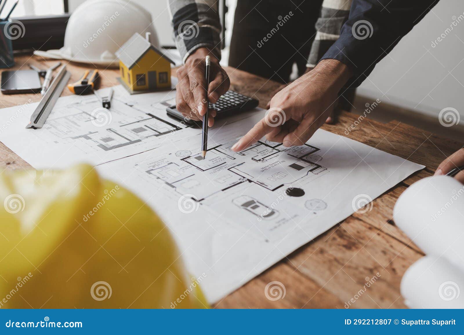 The Home Design Architects are Reviewing the House Plan Draft, the ...