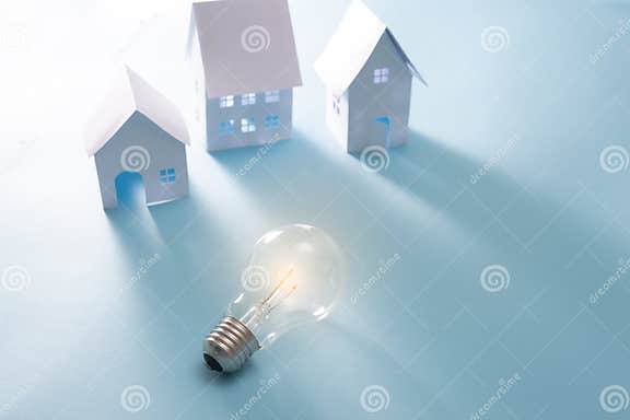 Home Energy with Light Bulb on the Blue Background Stock Photo - Image ...