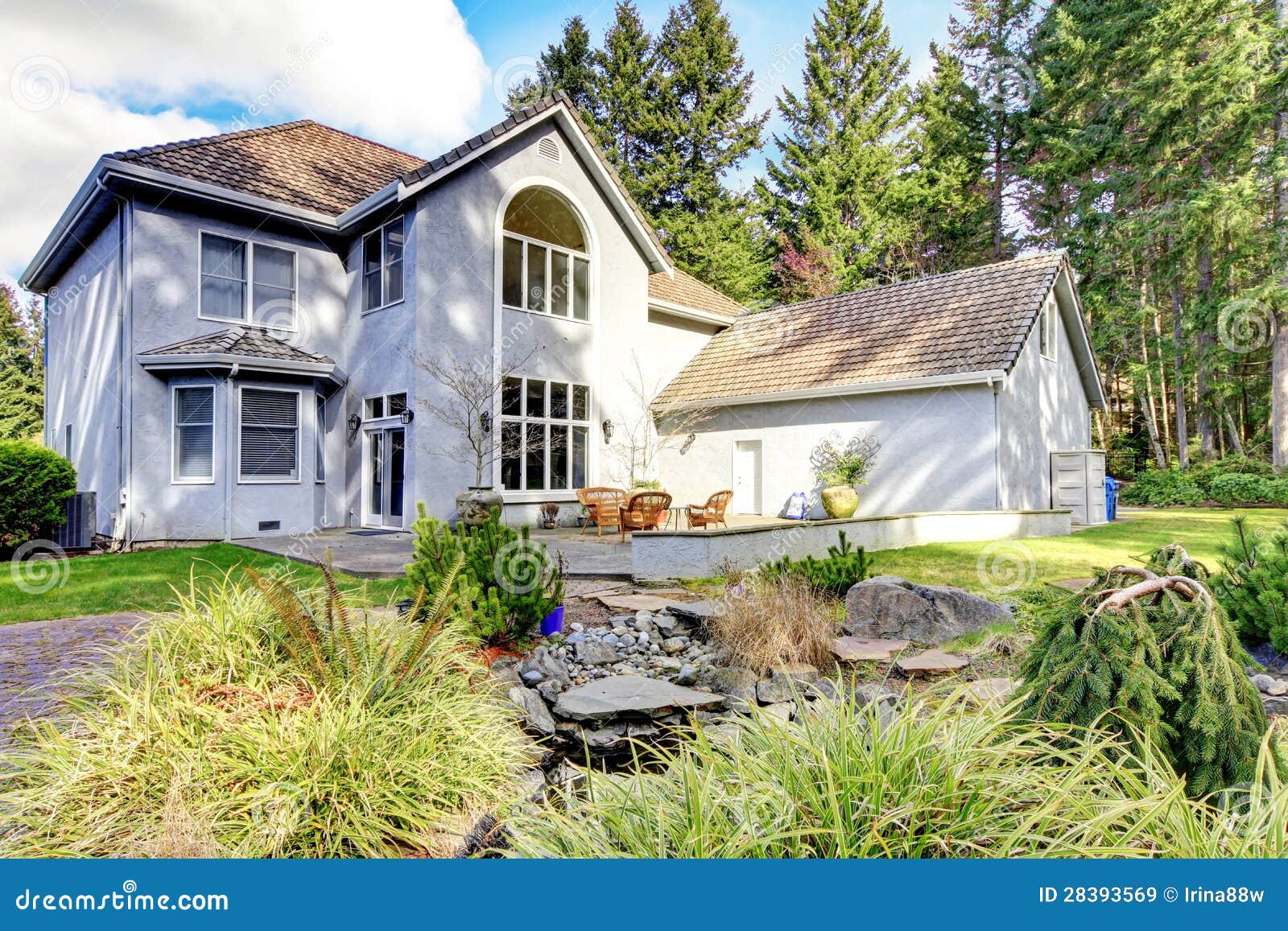 Home Exterior of Large Grey Classic House with Pine Trees. Stock Image ...