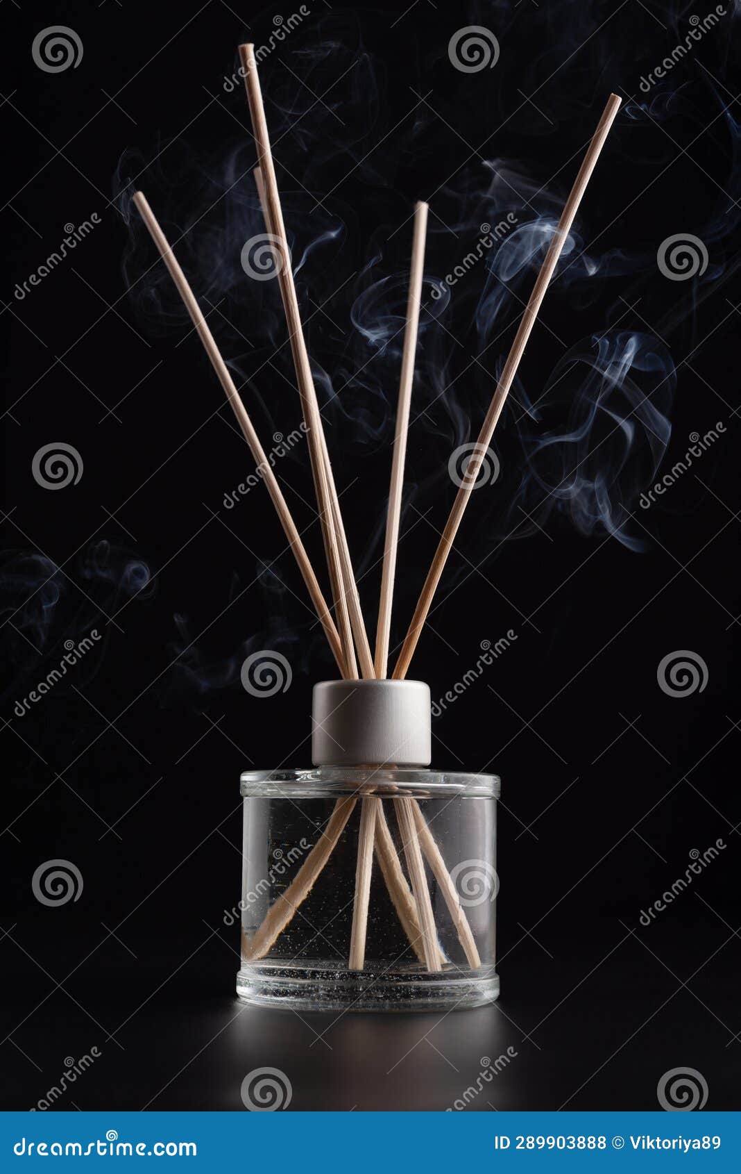 Home Fragrance Diffuser with Reed Sticks on Black Background with Smoke ...