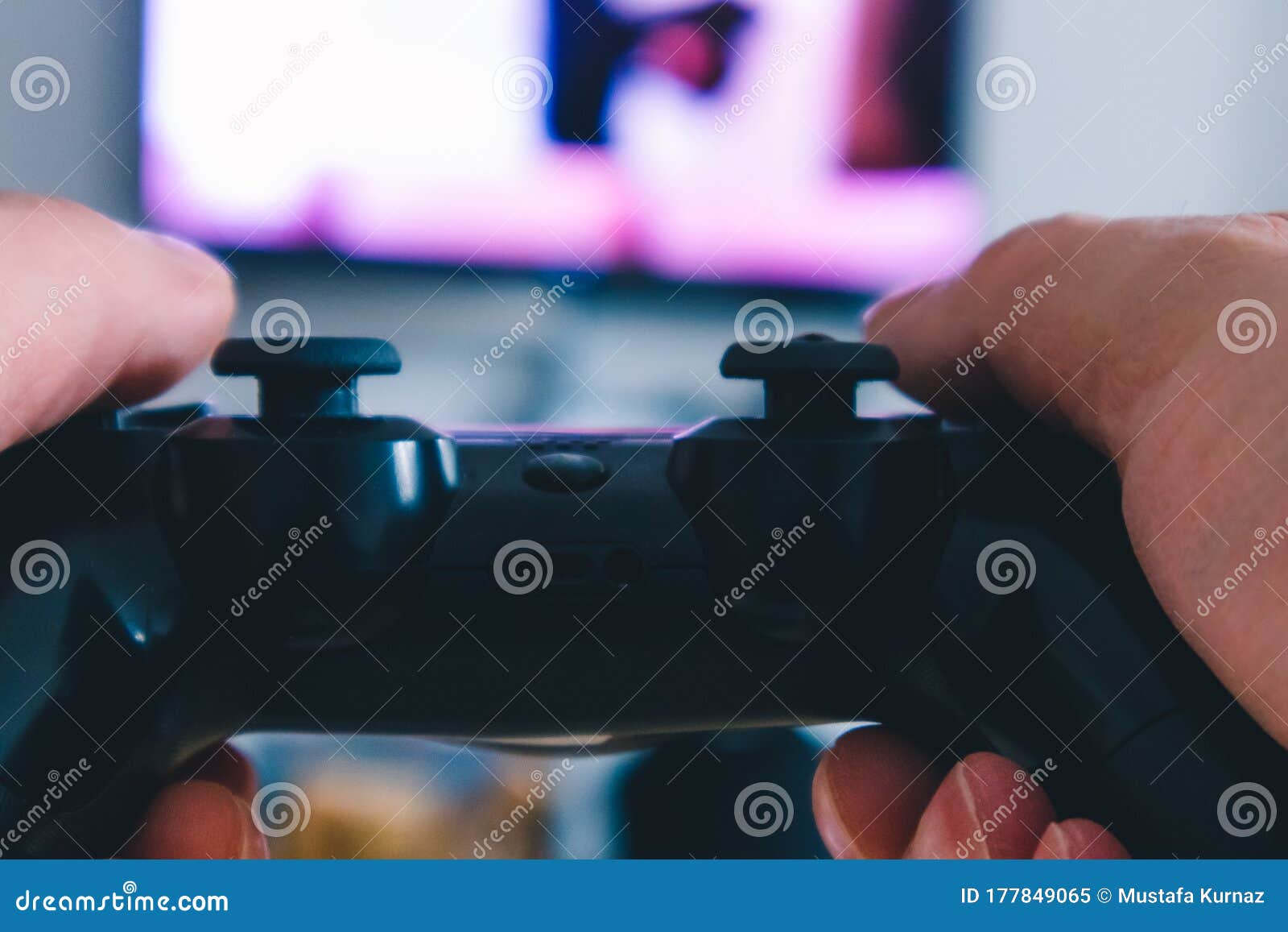At Home with a Game Console with a Wireless Controller Stock Image ...