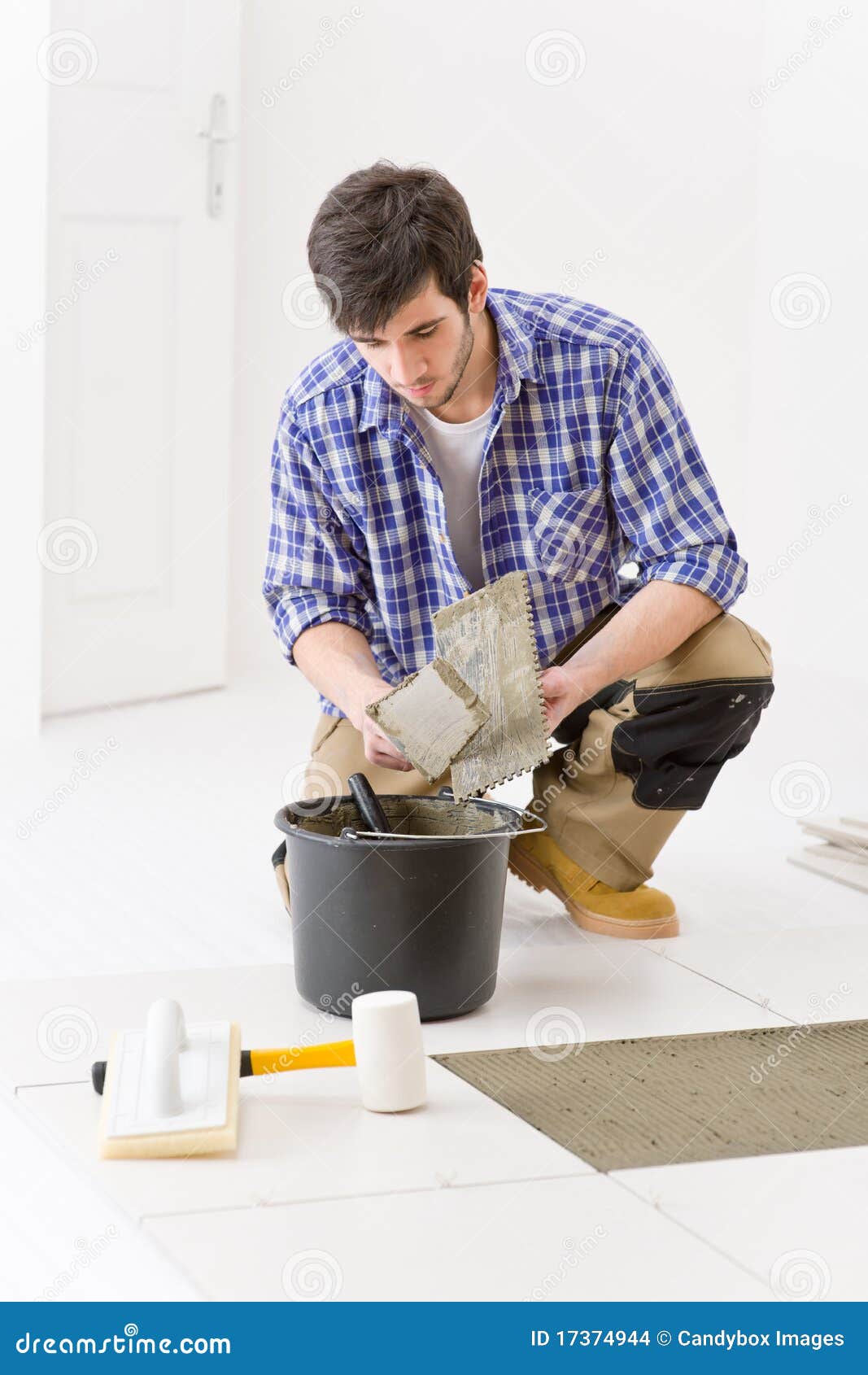 Home Improvement - Handyman Laying Tile Stock Photo - Image of modern ...