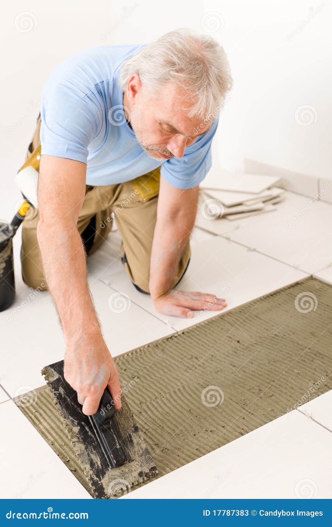 Home Improvement - Handyman Laying Tile Stock Image - Image of indoor ...