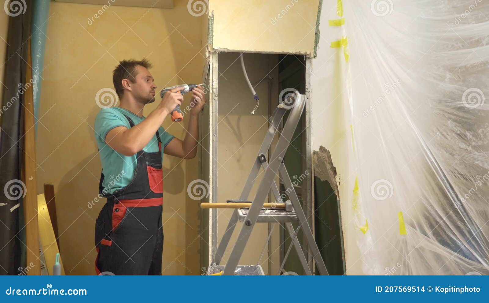 Home Improvement. a Man Dismantles a Drywall Arch in a Room Stock Photo ...