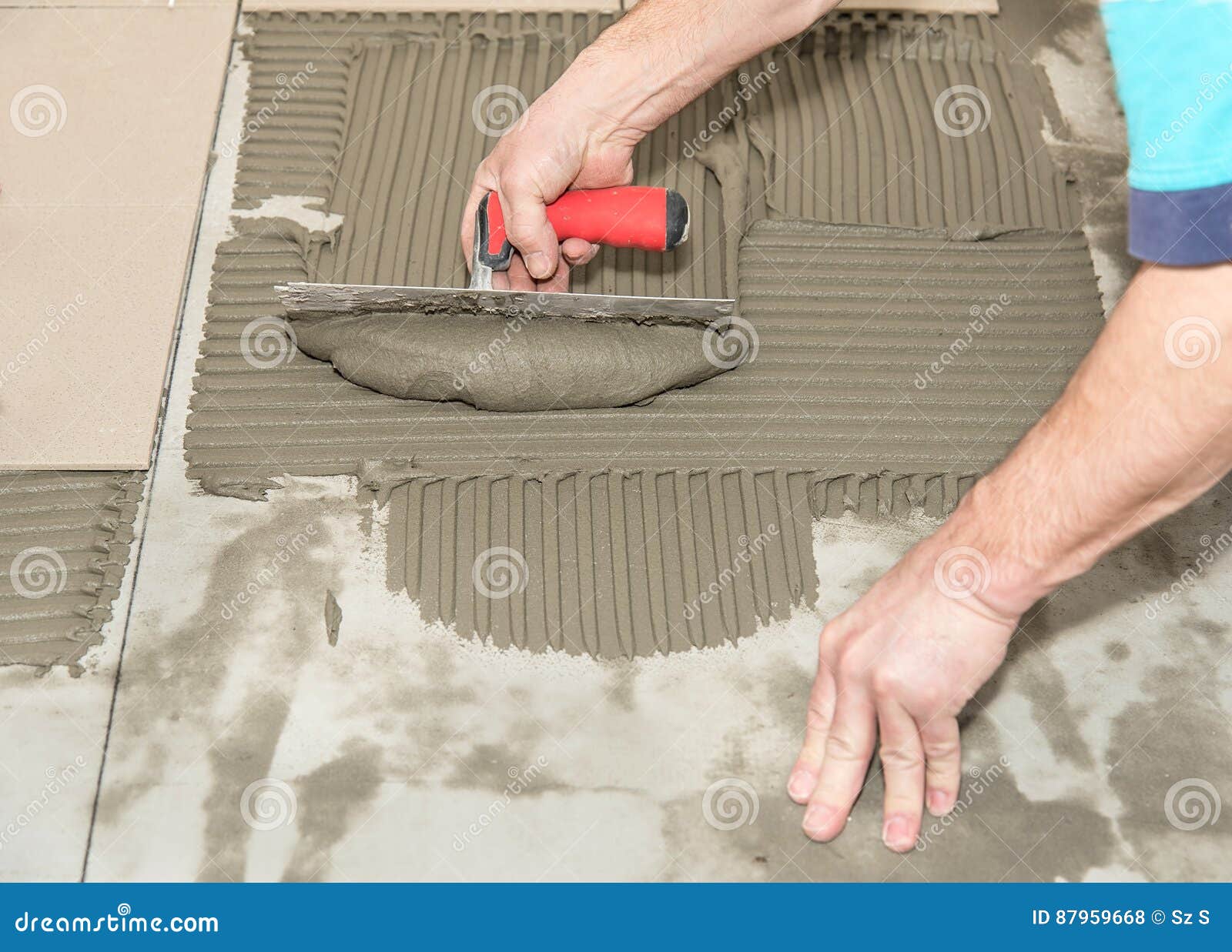 Home Improvement, Renovation. Construction Worker is Tiling, Ceramic ...