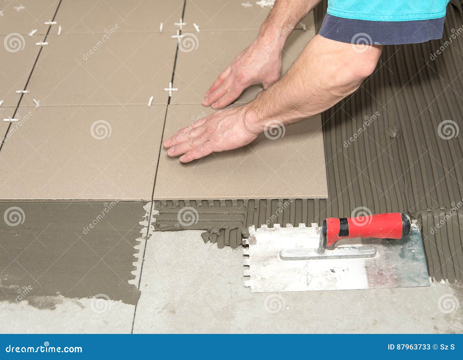 Home Improvement, Renovation. Construction Worker is Tiling, Ceramic ...