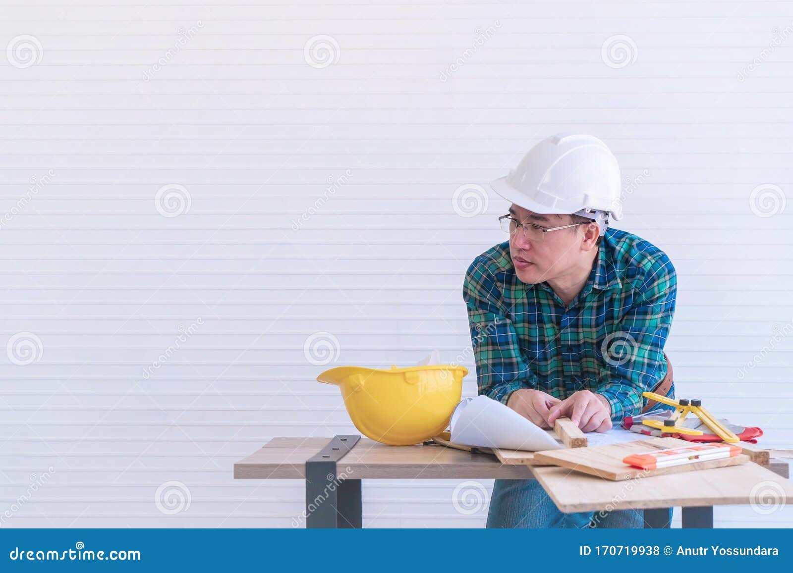 Home Improvement Worker Working on Workshop Table with Tools and ...