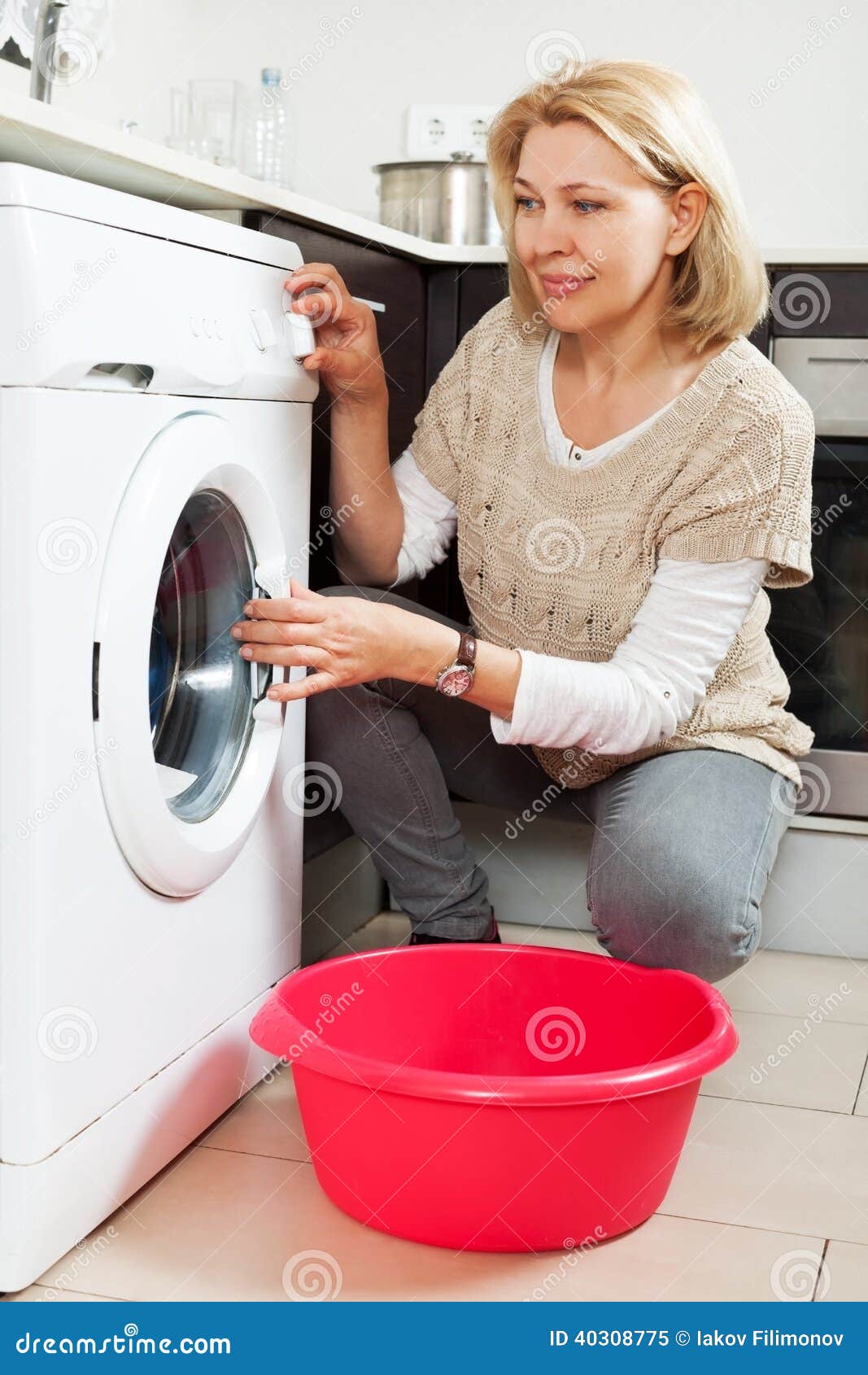 Home Laundry. Mature Woman Using Washing Machine Stock Image - Image of ...