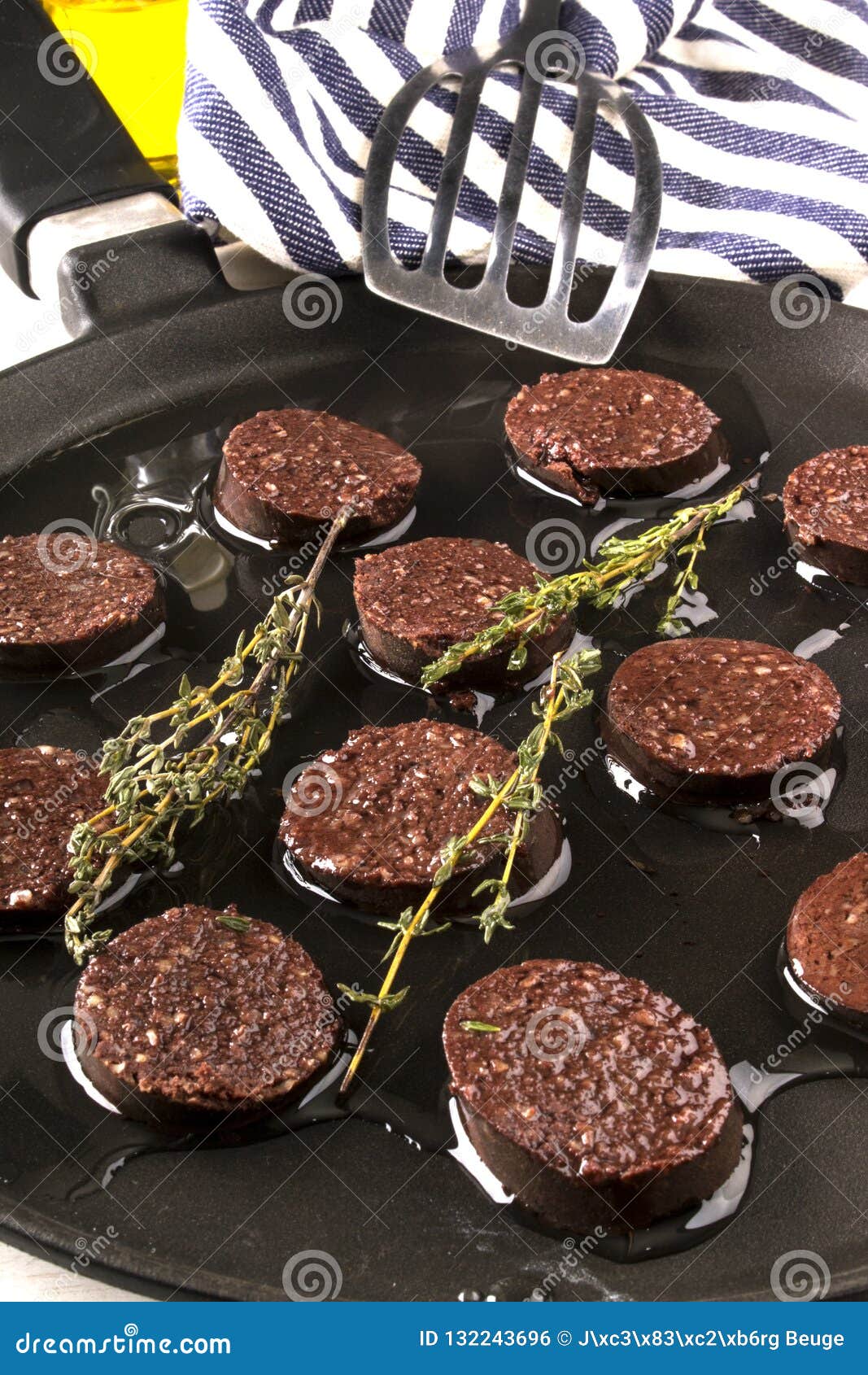 Home Made Black Pudding with Oil and Thyme in a Pan Stock Photo - Image ...
