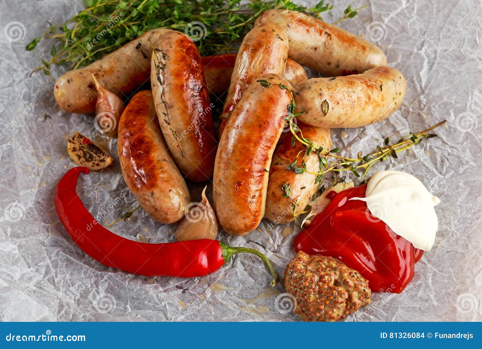 Home-made Pork Sausages on Crumpled Paper with Thyme Stock Photo ...