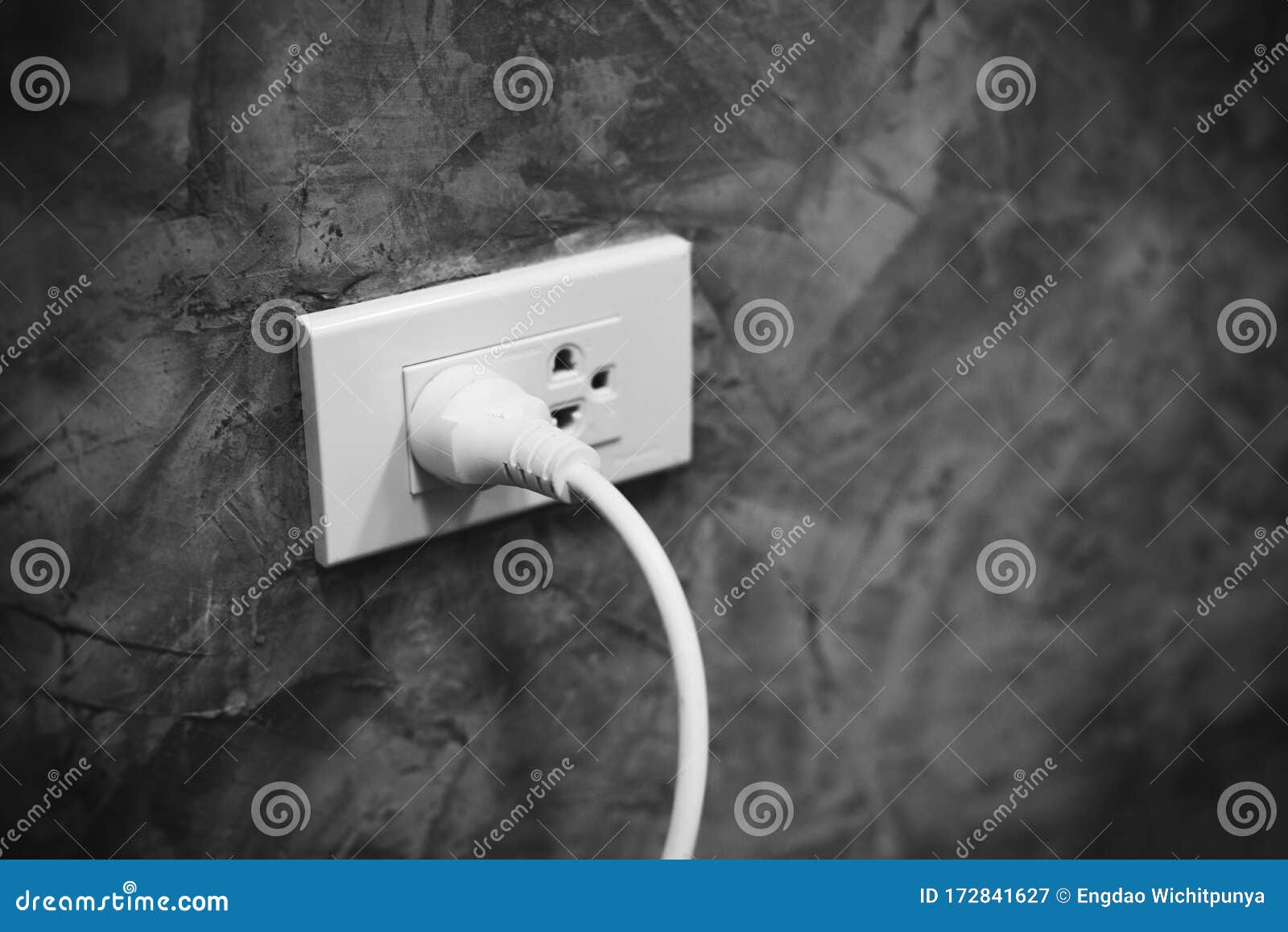 Home Outlet Plug is Plugging Socket on Wall with White Power Cord Cable ...