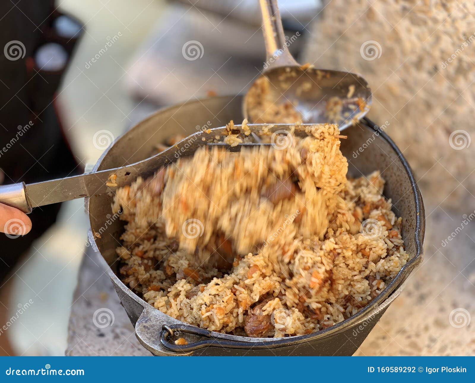 Home pilaf in a cauldron stock photo. Image of cuisine - 169589292