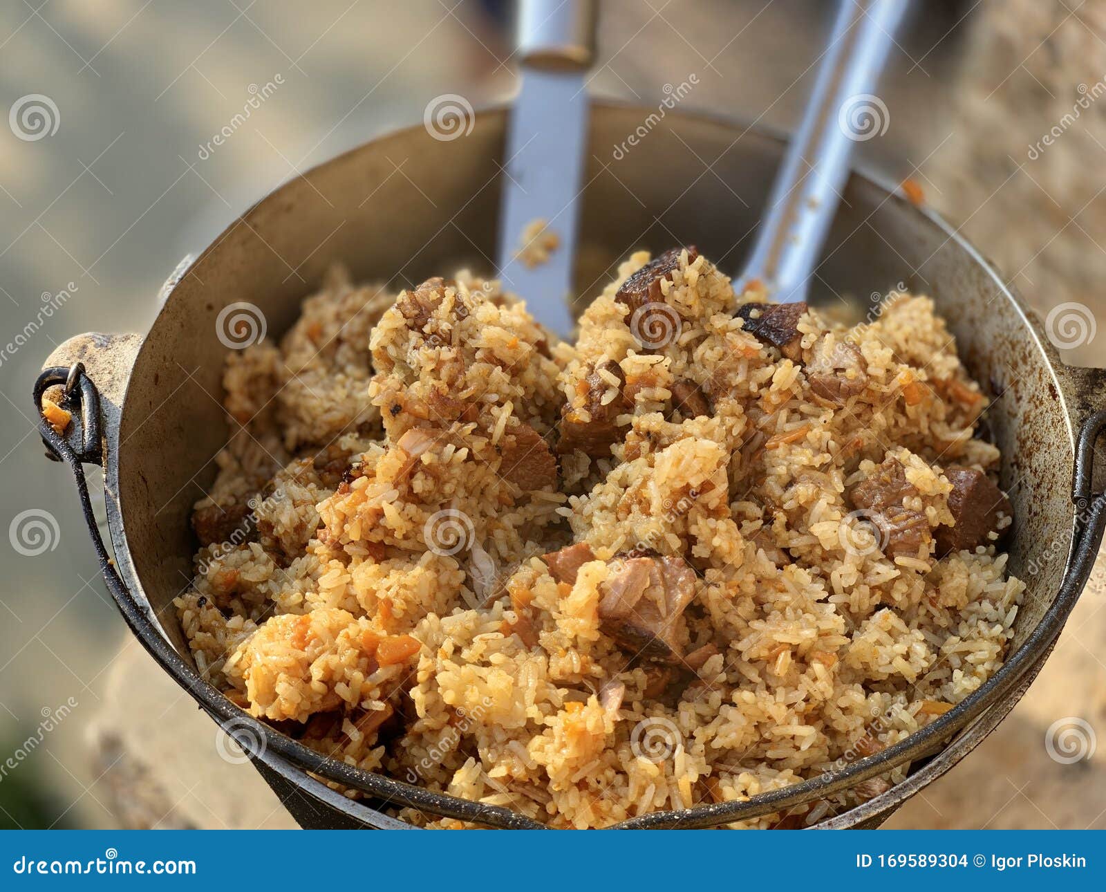 Home pilaf in a cauldron stock photo. Image of cook - 169589304