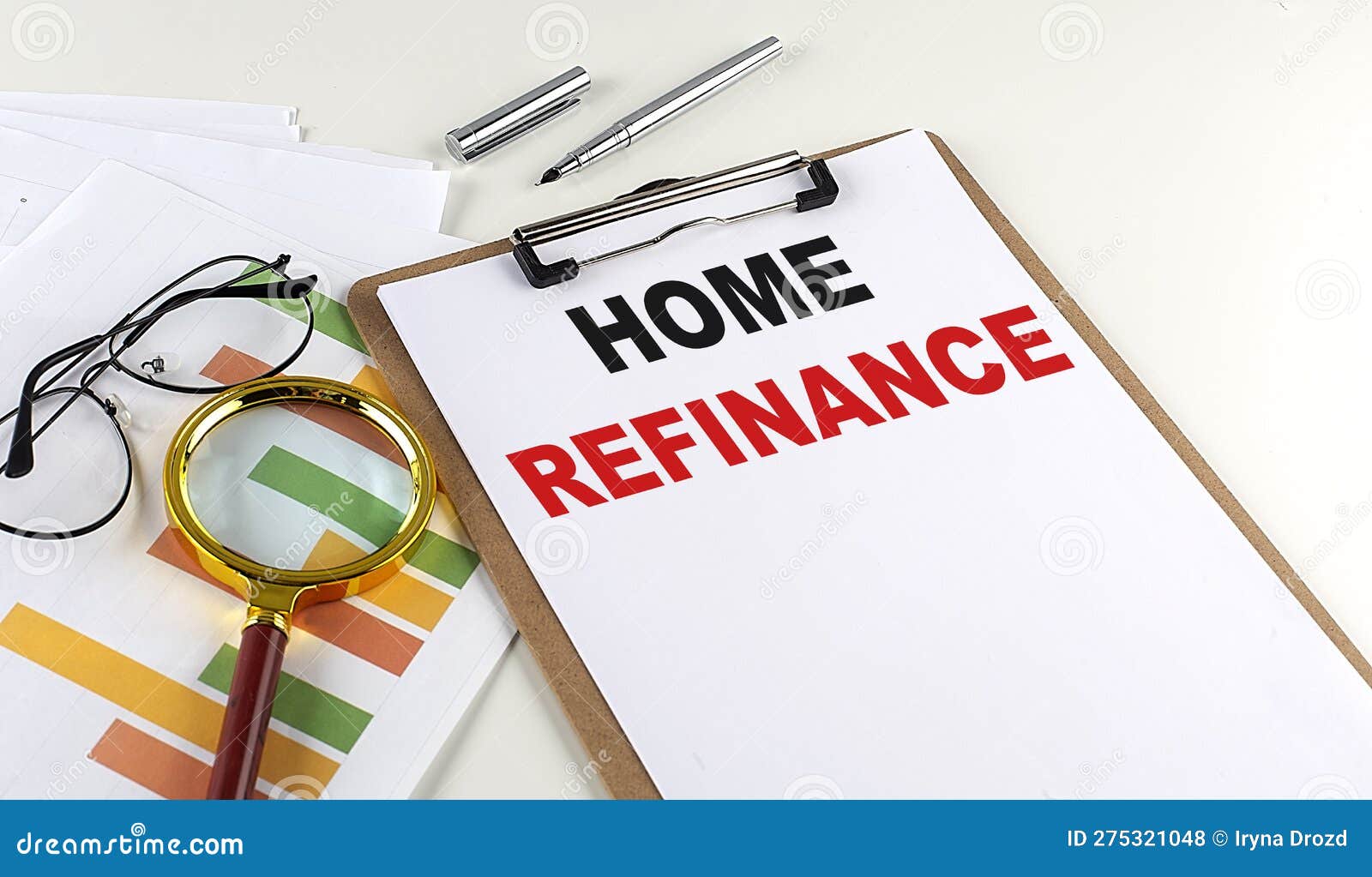 HOME REFINANCE Text on Clipboard with Chart on White Background ...
