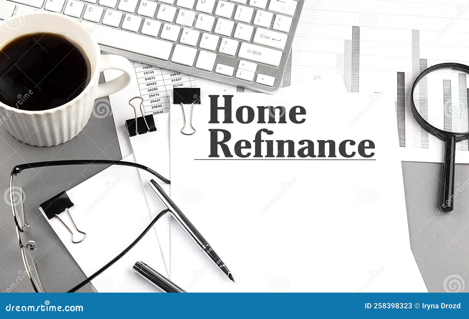 HOME REFINANCE Text on a Paper with Magnifier, Coffee and Keyboard on ...