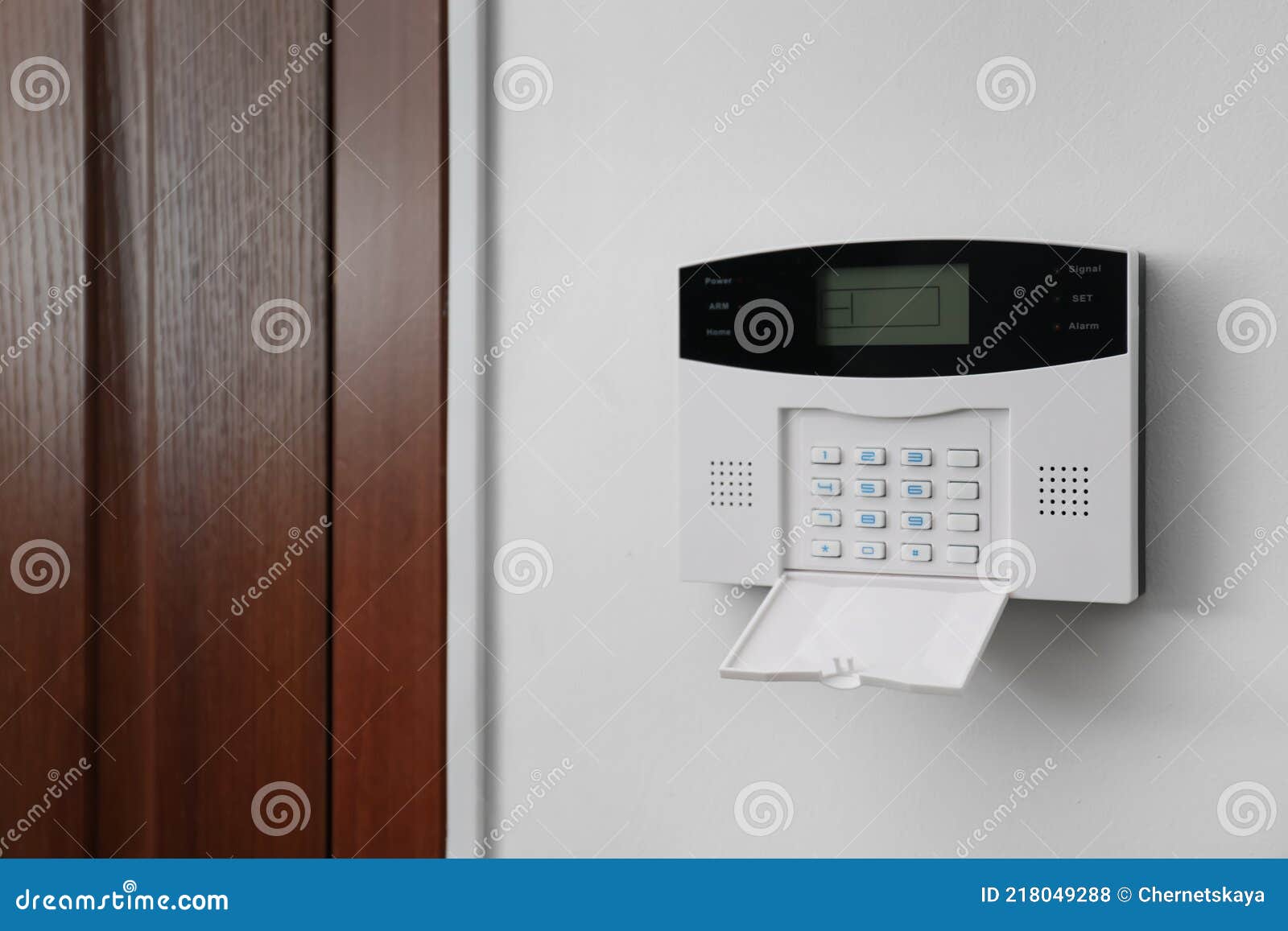 Home Security Alarm System on White Wall Near Door, Space for Text ...