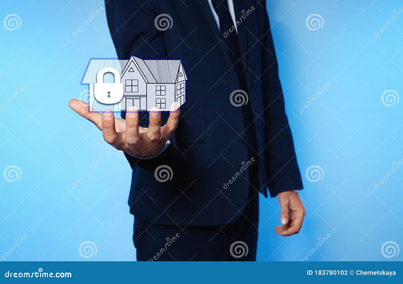 Home Security Concept. Man Holding House on Blue Background, Closeup ...