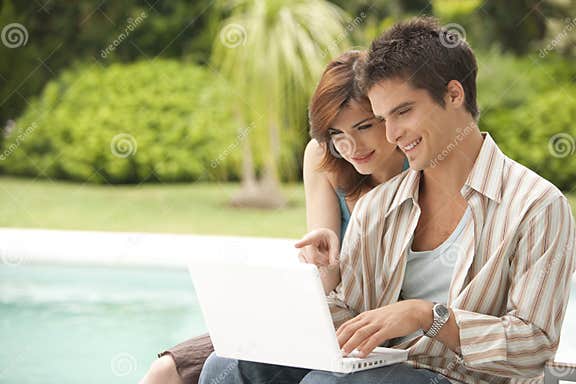 Home Tech Couple with Laptop by Pool Stock Image - Image of house ...