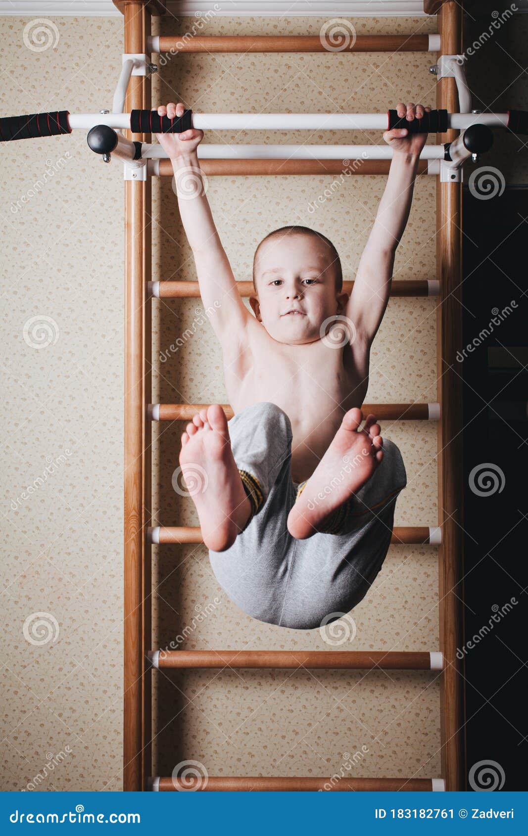 Home Workout. the Boy Raises His Legs in the Hang Stock Image - Image ...