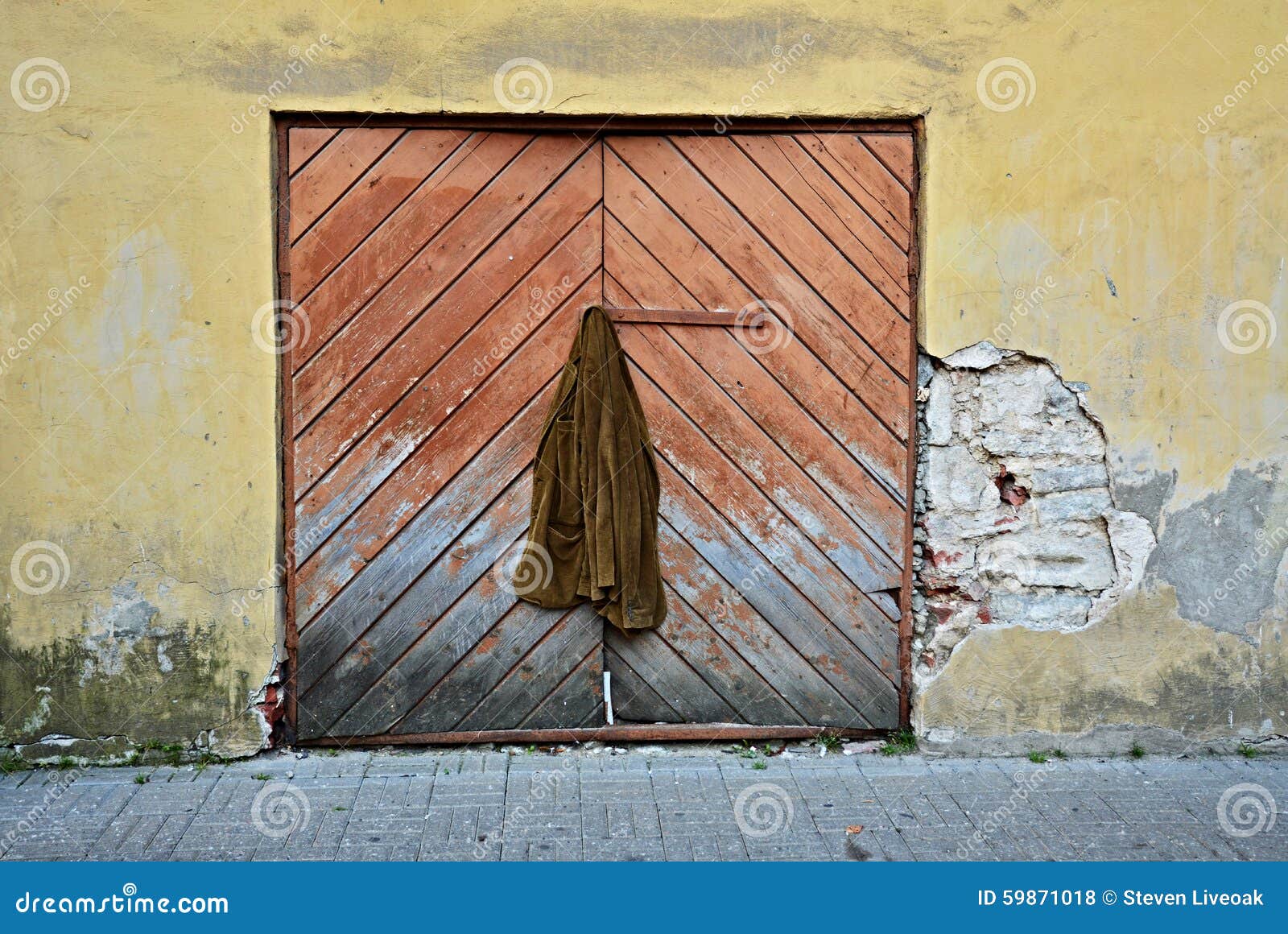 Homeless Jacket on an Old Door Stock Photo - Image of background ...