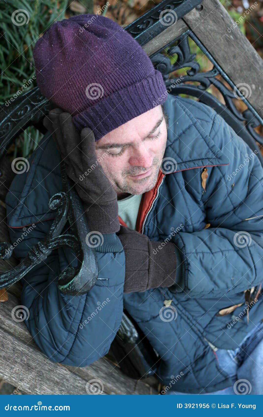 Homeless Man Keeps Warm stock photo. Image of bench, beard - 3921956