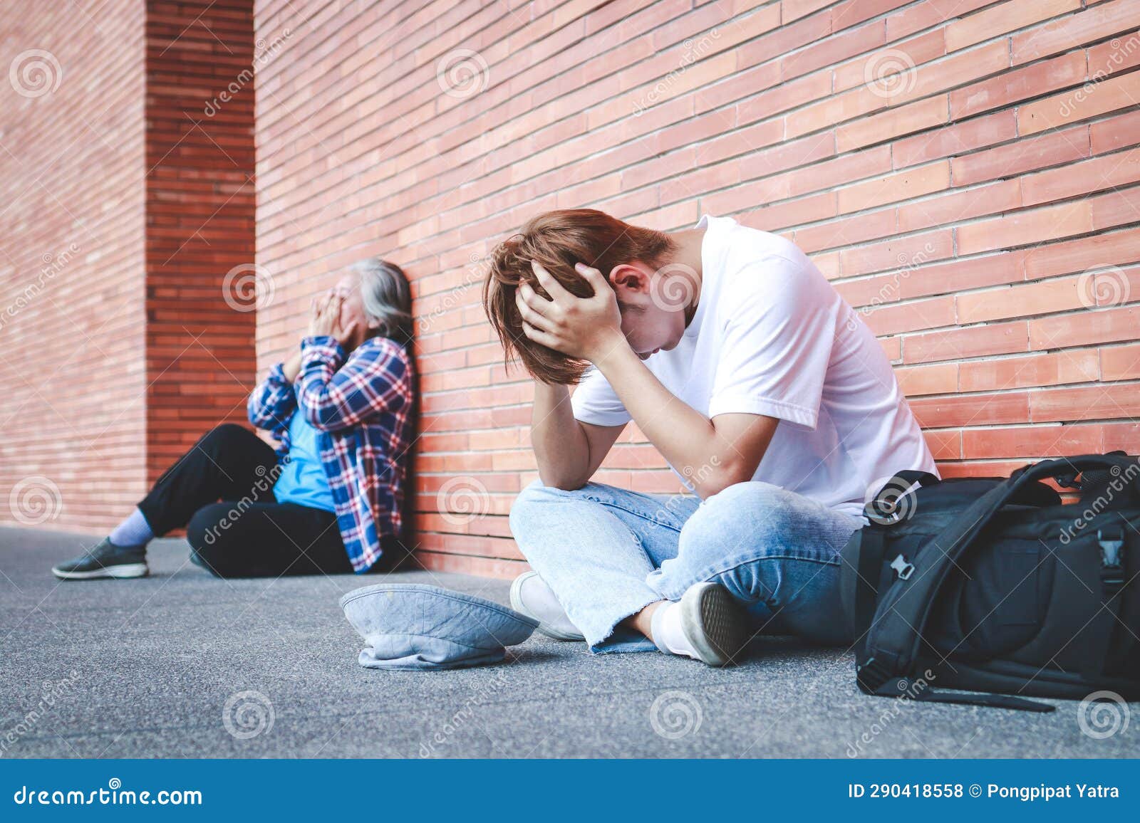 Homeless Man Sitting by a Brick Wall Stock Photo - Image of home, male ...