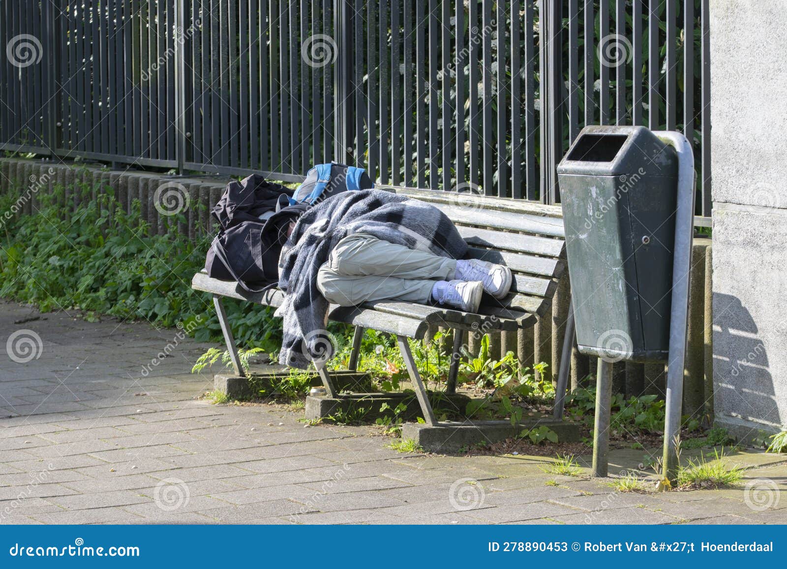 Homeless Man Sleeping on a Bench at Amsterdam the Netherlands 17-5-2023 ...