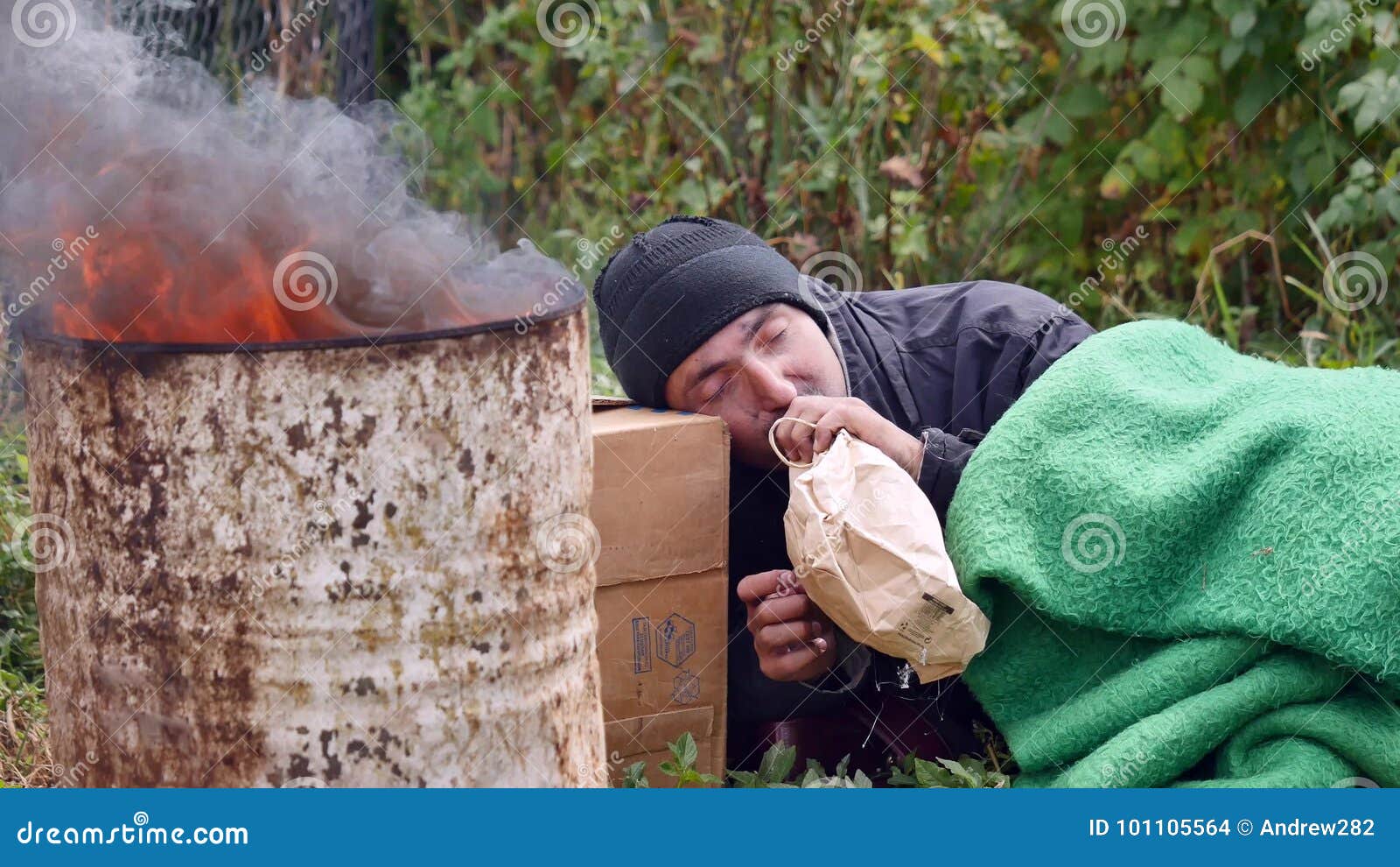 A Homeless Man Sleeping Near the Fire Stock Photo - Image of poverty ...