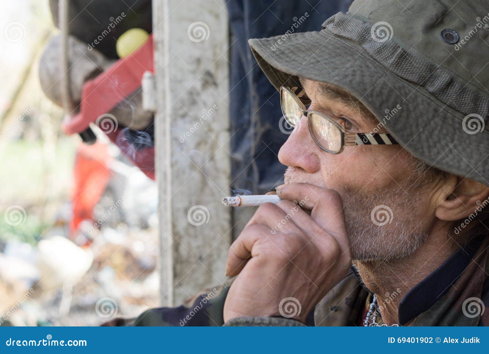 Homeless man smoking stock photo. Image of caucasian - 69401902