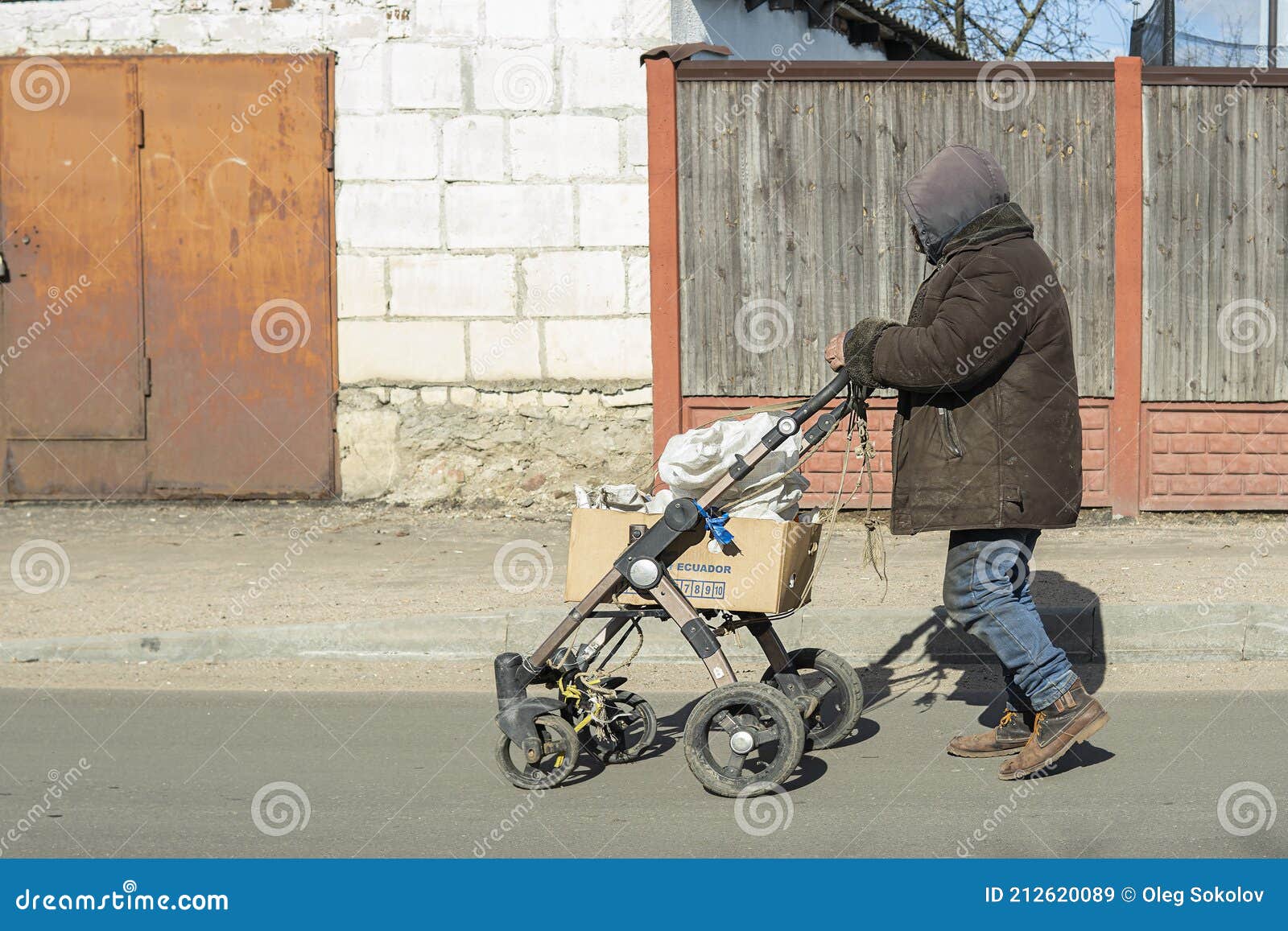 Homeless Man Walking Down the Road on a Sunny Day. Stock Image - Image ...