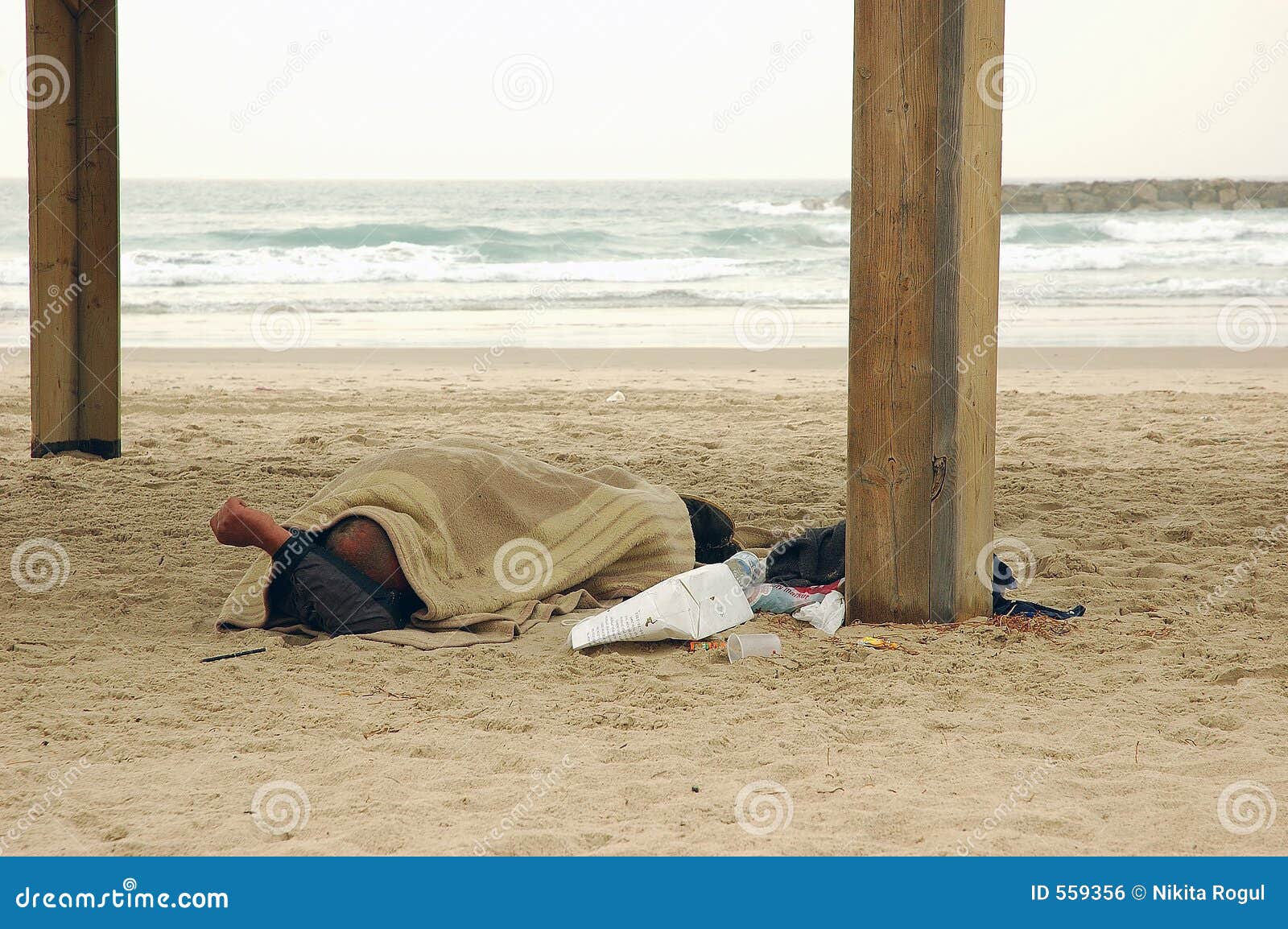 Homeless Person Sleeping on Beach Stock Photo - Image of winter, beach ...