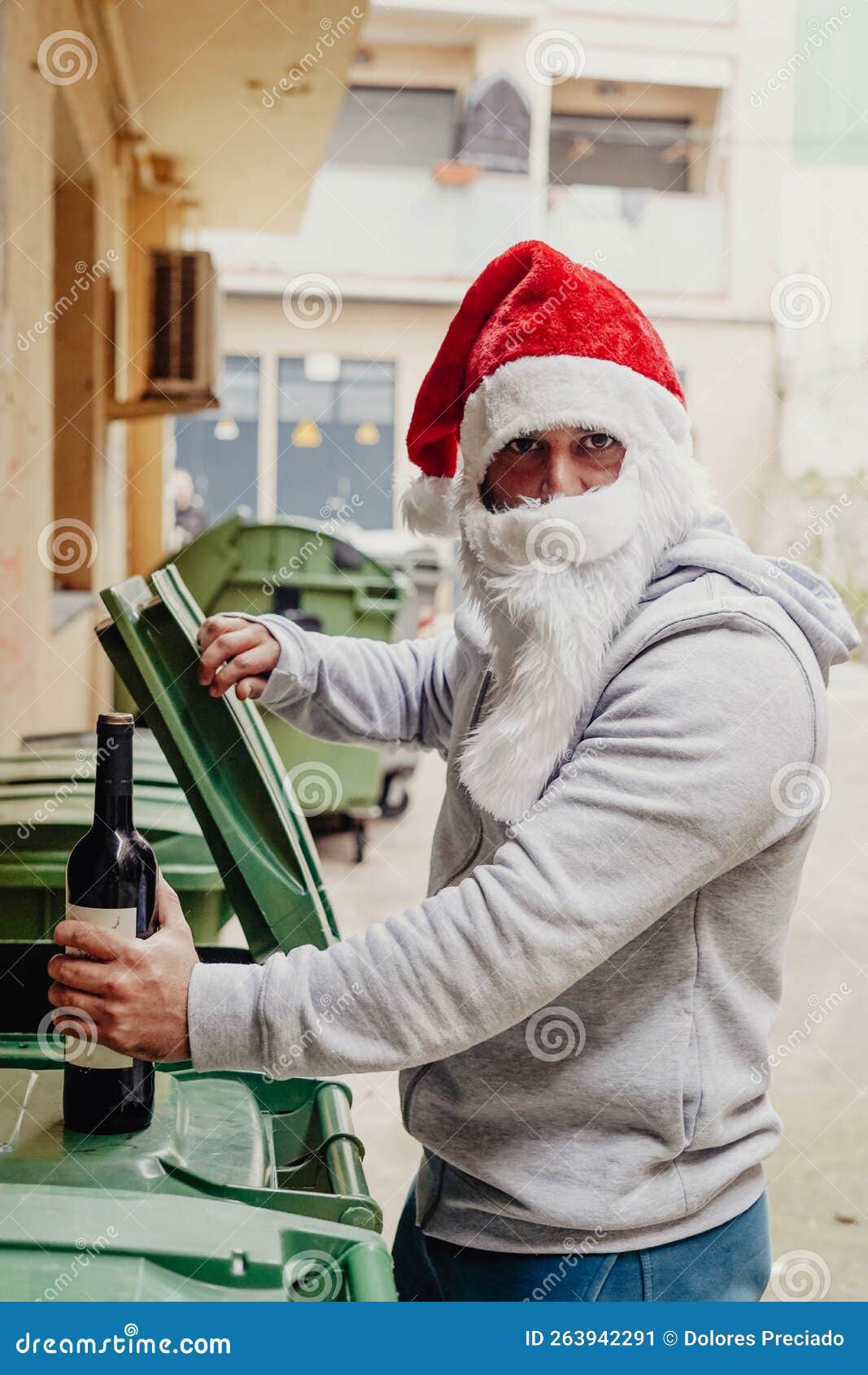 Homeless Santa Drinking Wine and Rummaging through Garbage Bins Stock ...
