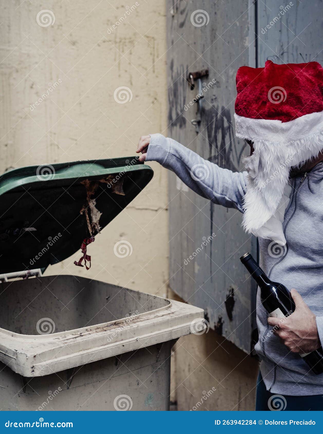 Homeless Santa Drinking Wine and Rummaging through Garbage Bins Stock ... Homeless Santa Drinking Wine and Rummaging through Garbage Bins Stock ...