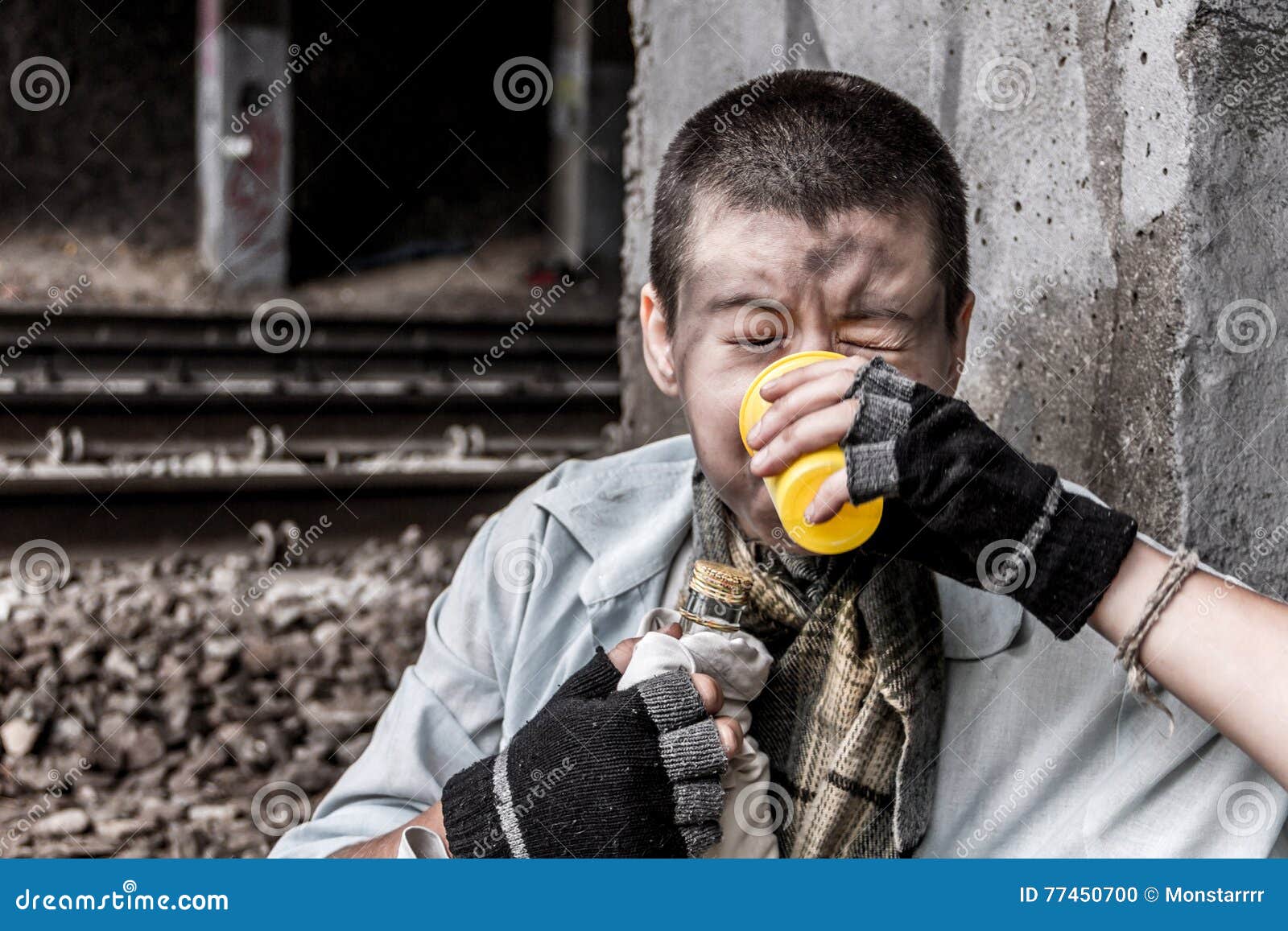 Homeless woman drinking stock photo. Image of gloves - 77450700