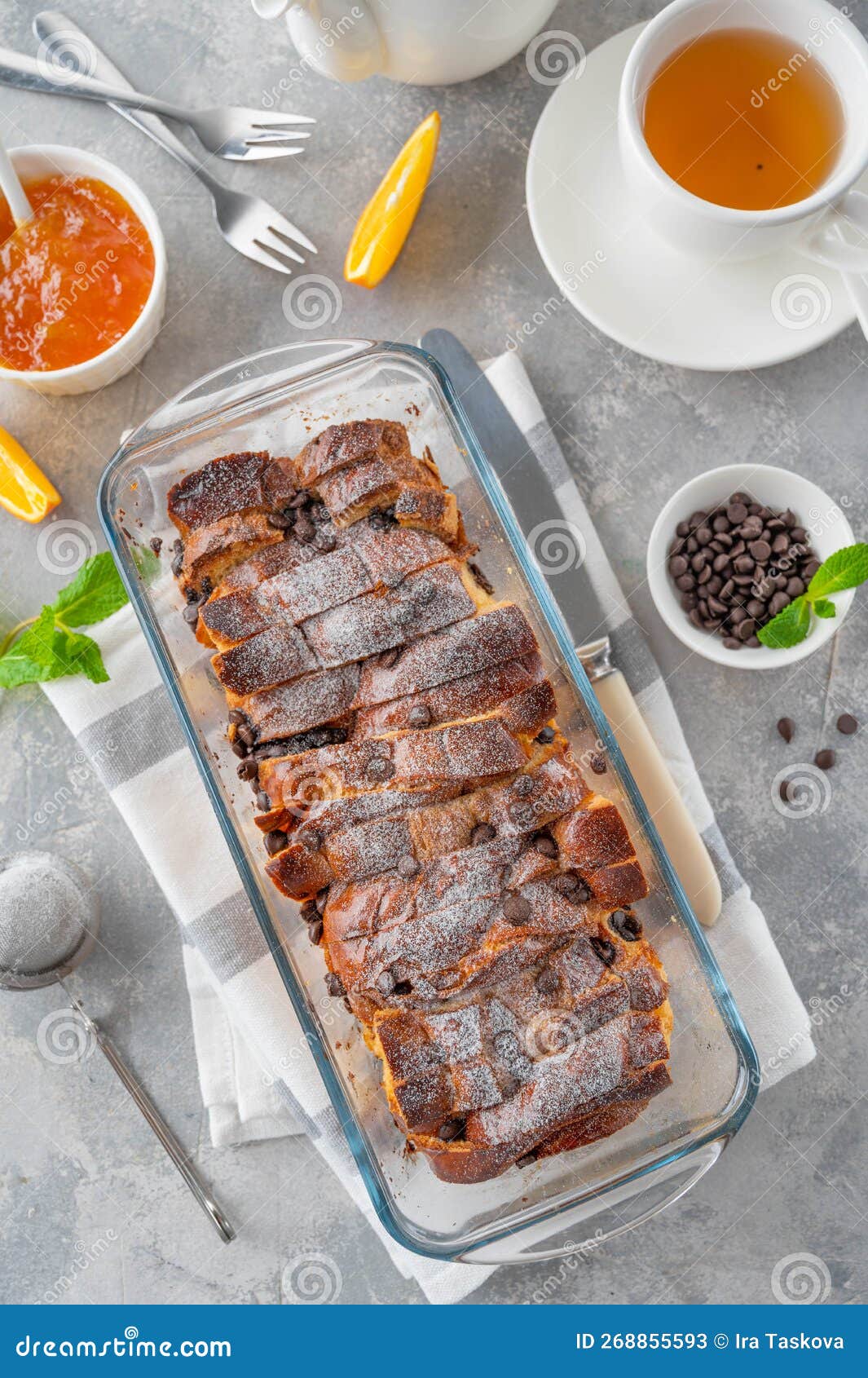 Homemade Bread Pudding with Chocolate Chips on a Gray Concrete ...