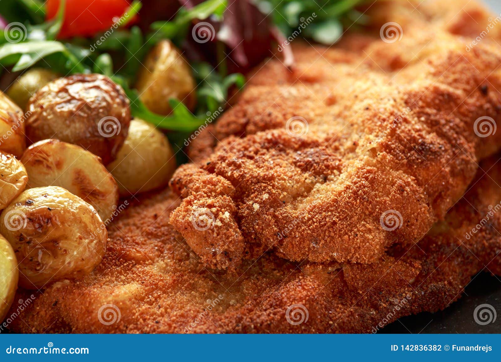 Homemade Breaded Pork Schnitzel with Roast Potato and Vegetables Stock ...