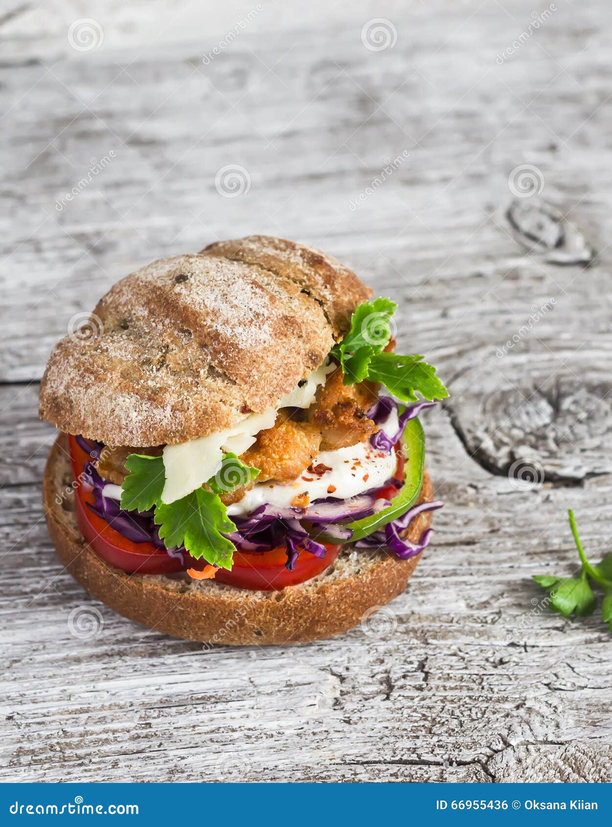 Homemade Crispy Fish Burger on a Rustic Wooden Board Stock Photo ...