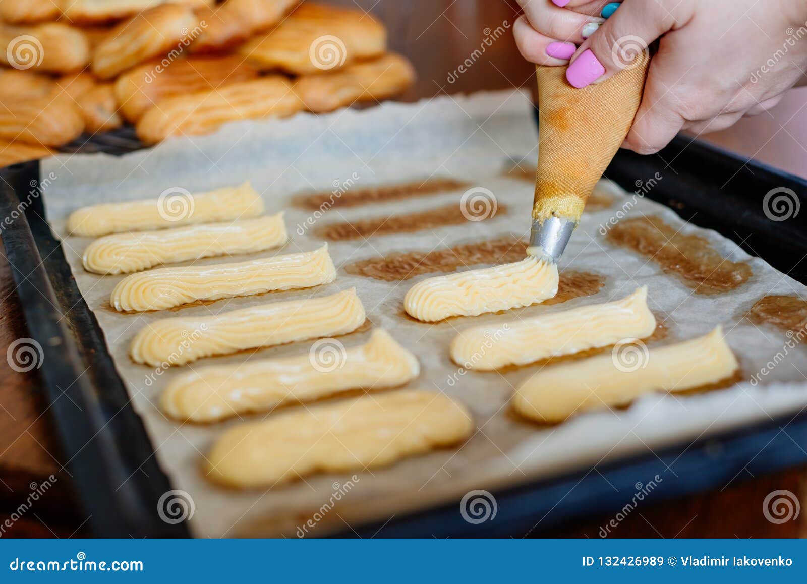 Homemade Eclairs. Preparation of Eclairs in the Home Kitchen Stock ...