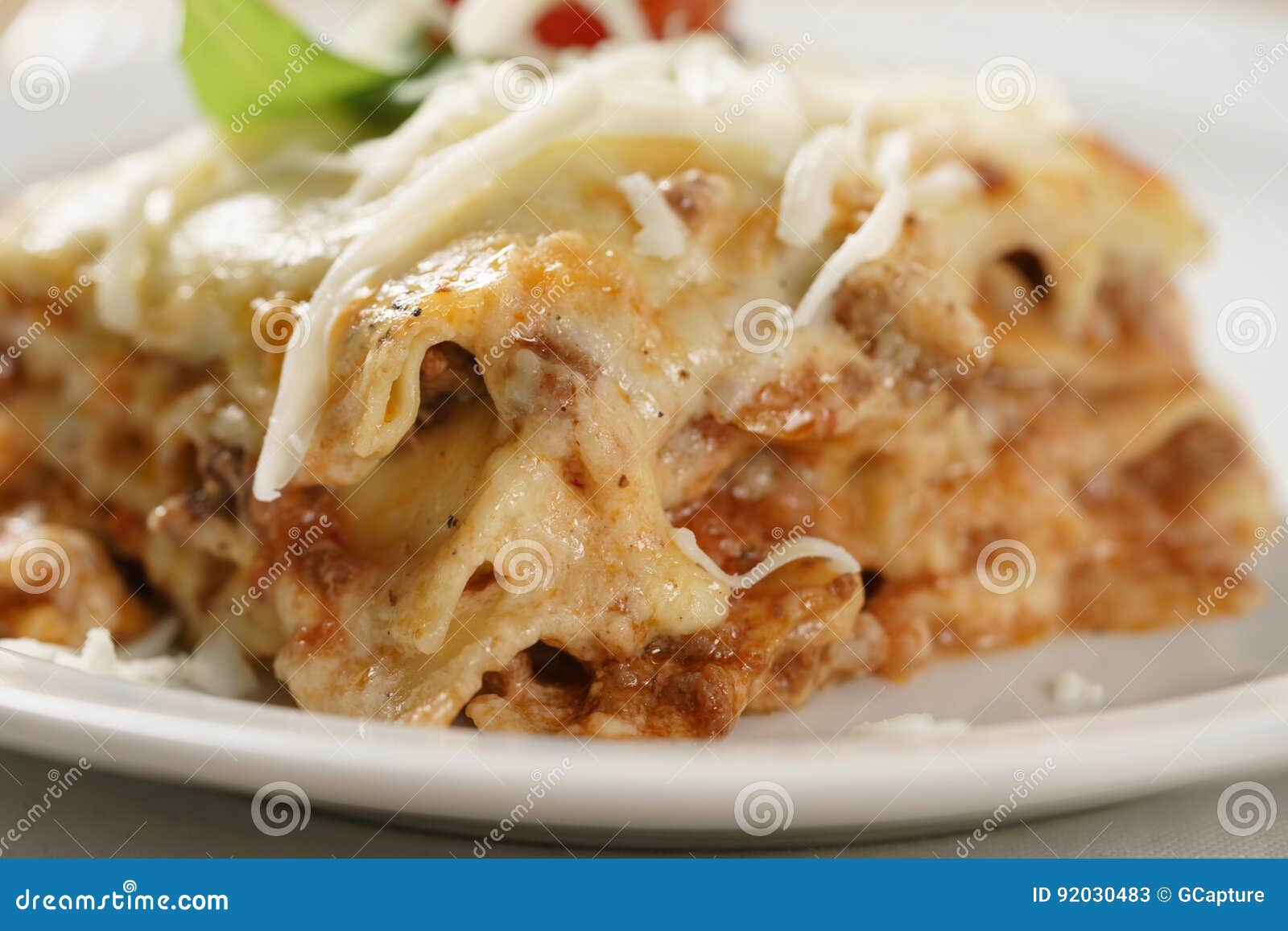 Homemade Lasagna Portion on White Plate on Wood Table Stock Image ...