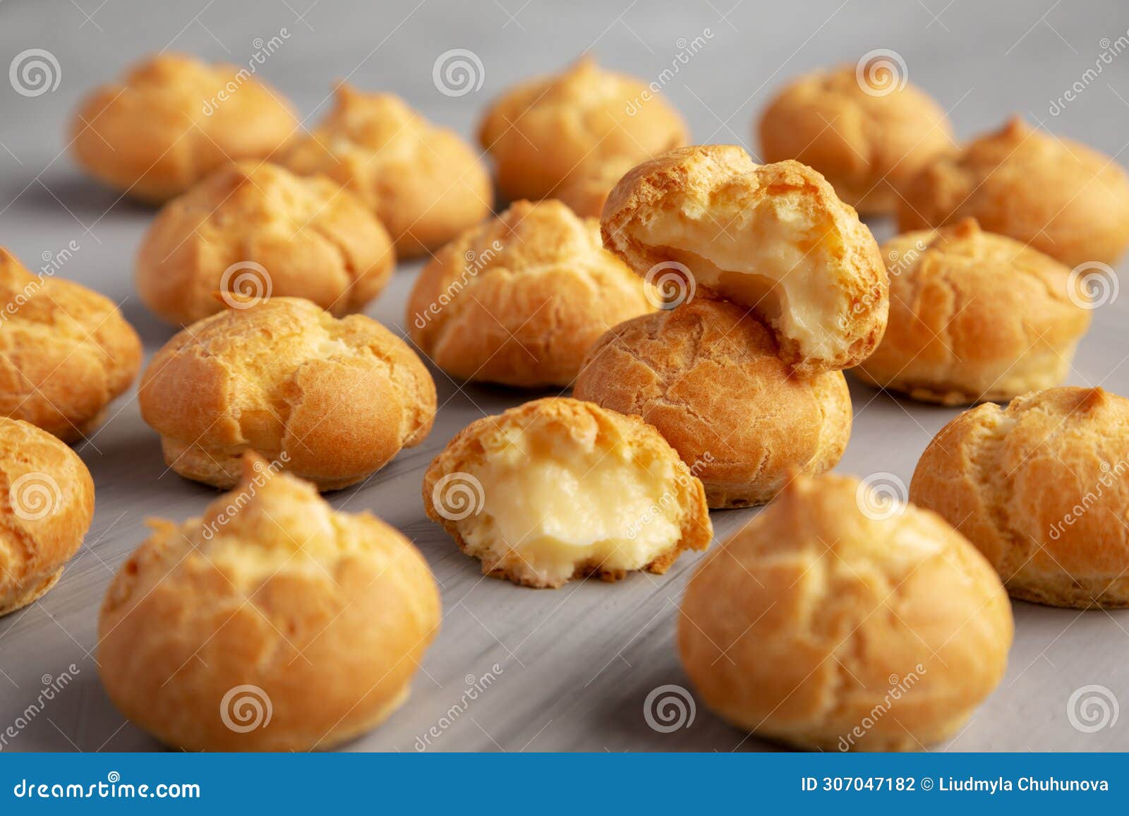 Homemade Mini Cream Puffs on a Gray Background, Side View Stock Photo ...