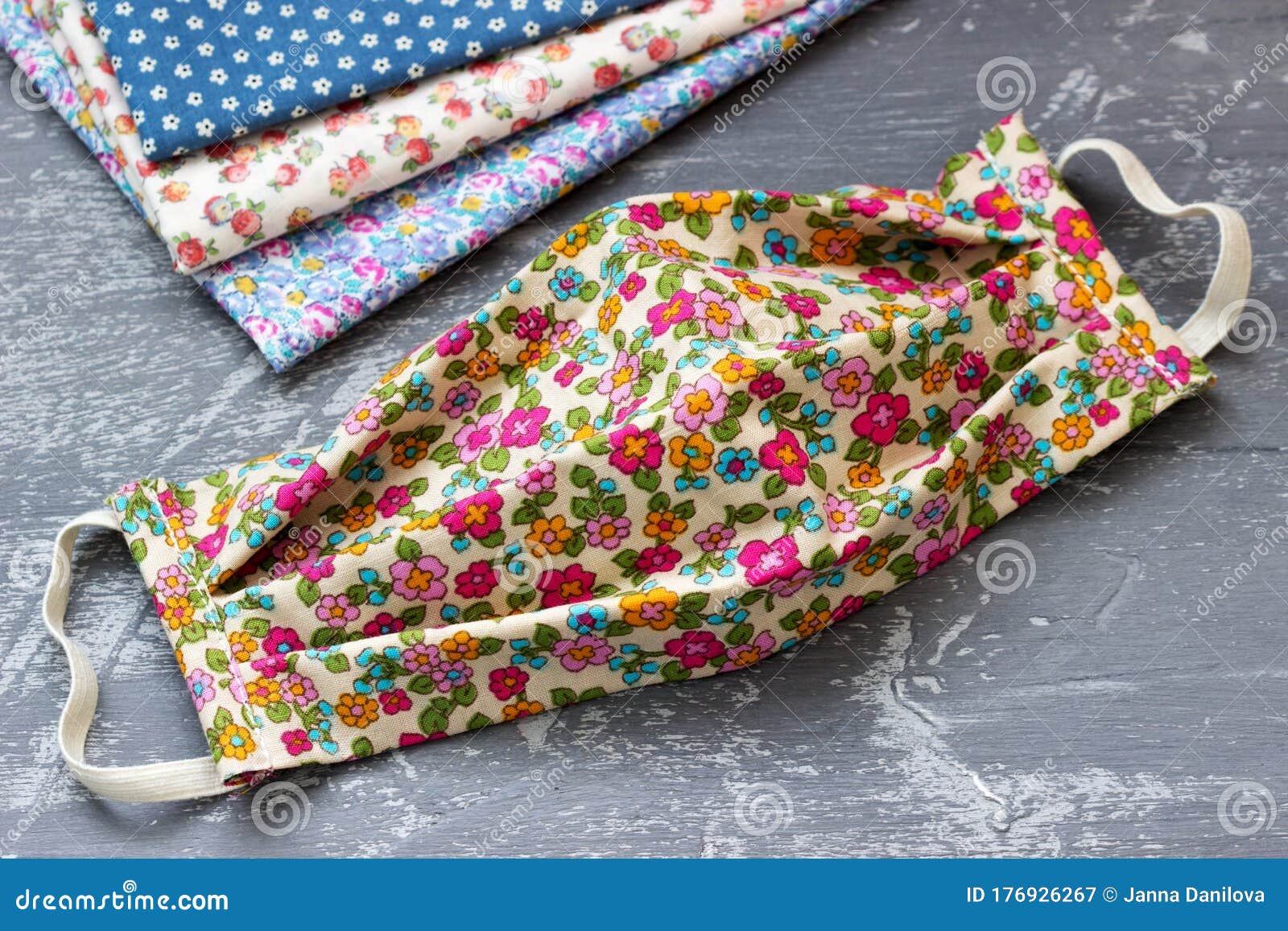 Homemade Protective Mask and Pieces of Cloth on a Gray Background Stock ...