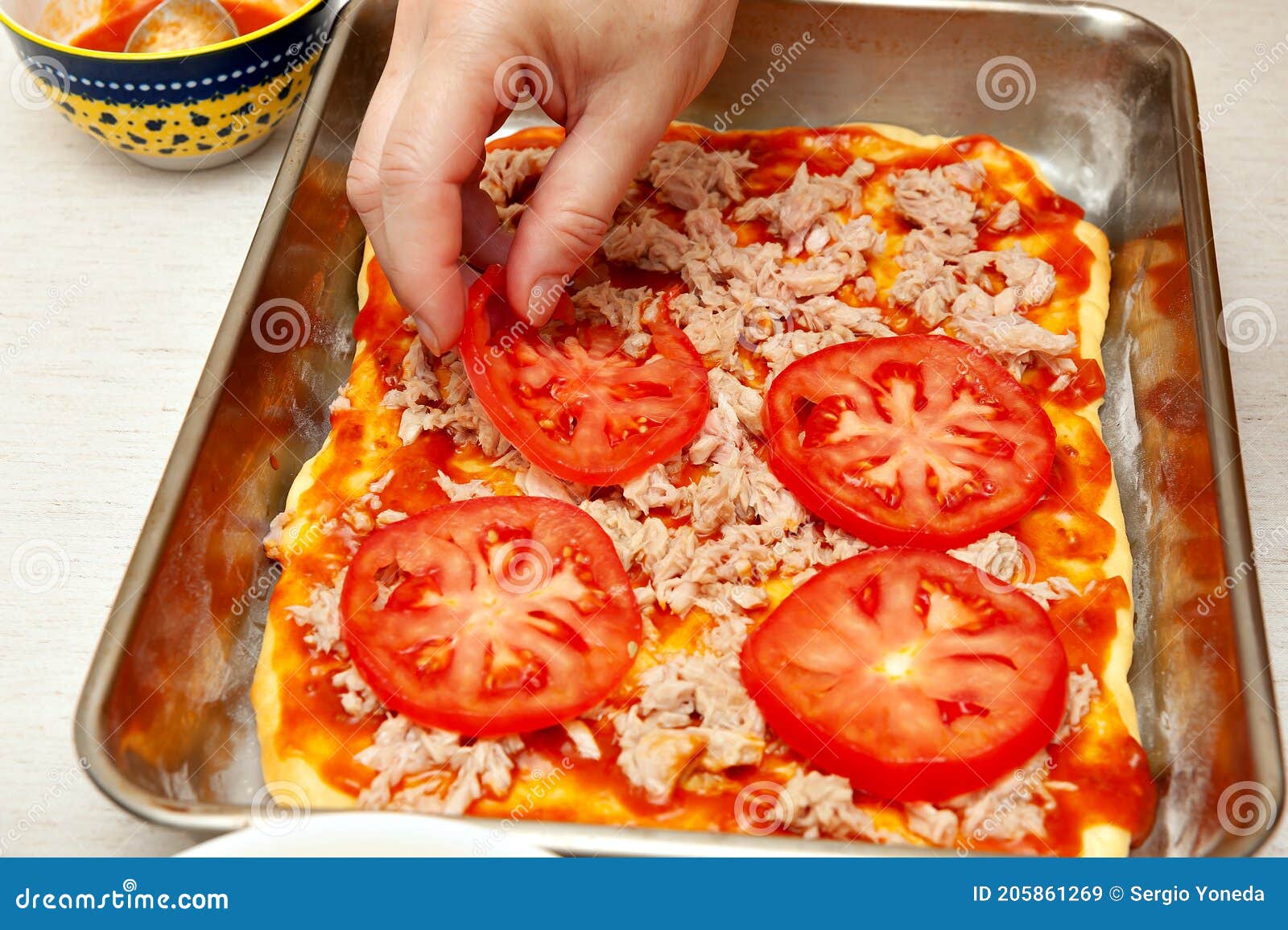 Homemade Rectangular Pizza - Hand Putting Sliced Tomatoes on Pizza. Top ...