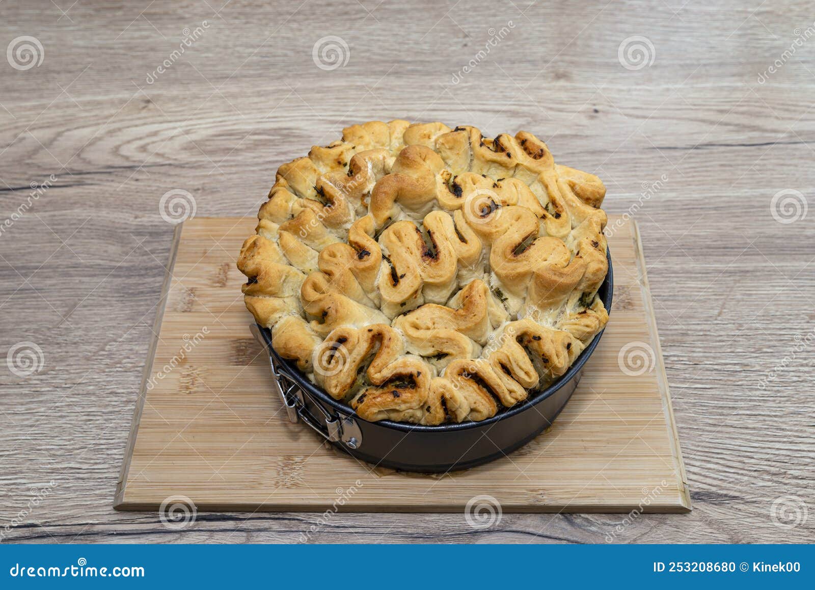 Homemade Round Bread with Garlic Butter and Herbs, in a Round Baking ...