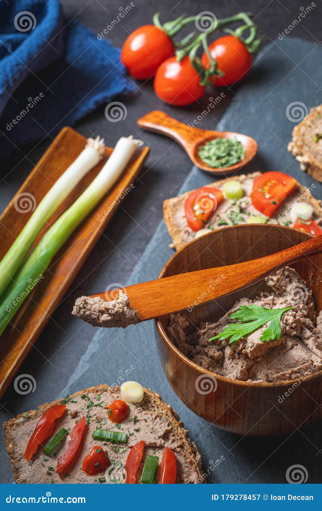 Homemade Rustic Pate on a Bitten Slice of Bread with Fresh Vegetables ...