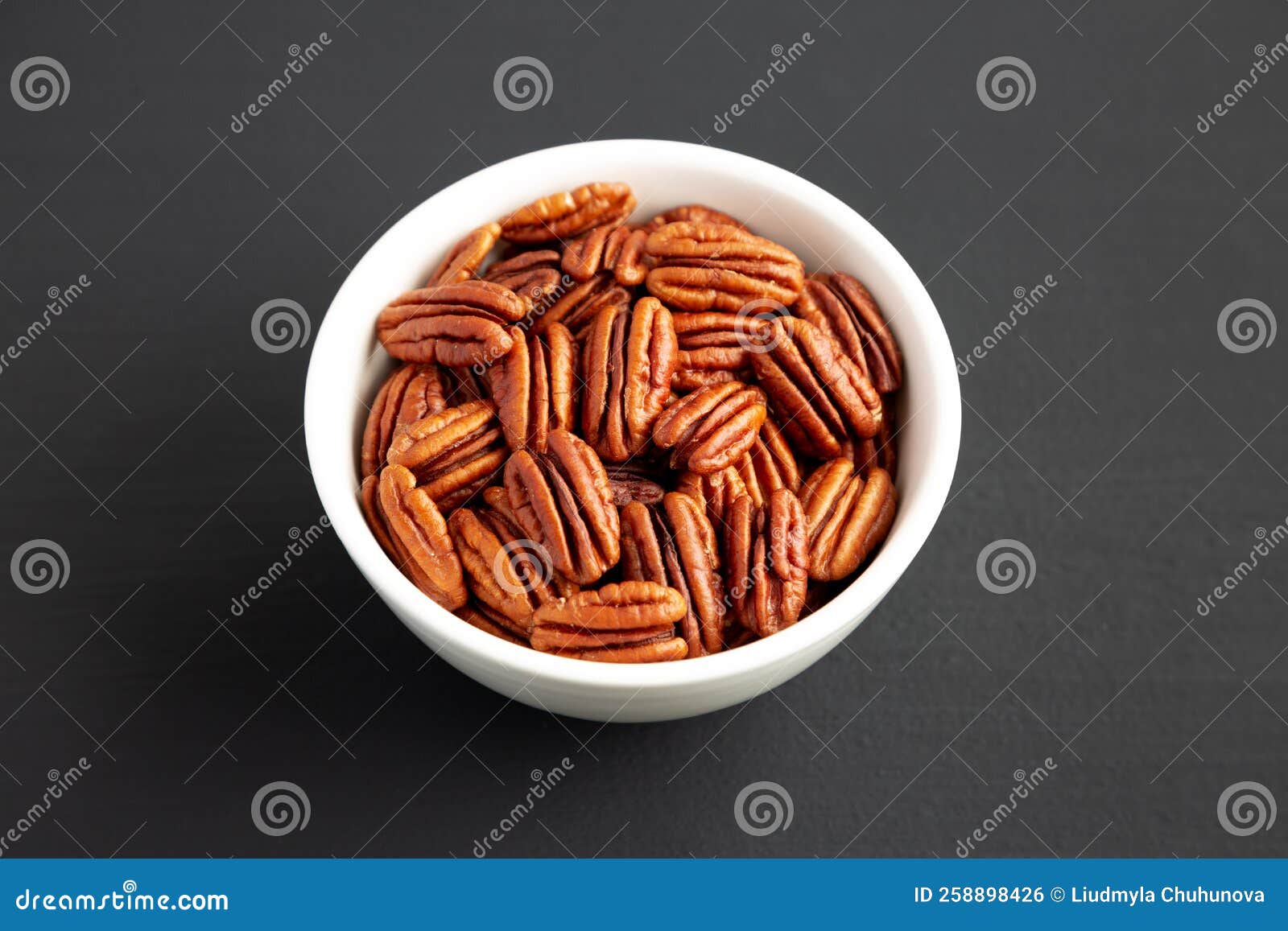 Homemade Shelled Pecans in a Bowl on a Black Background, Side View ...