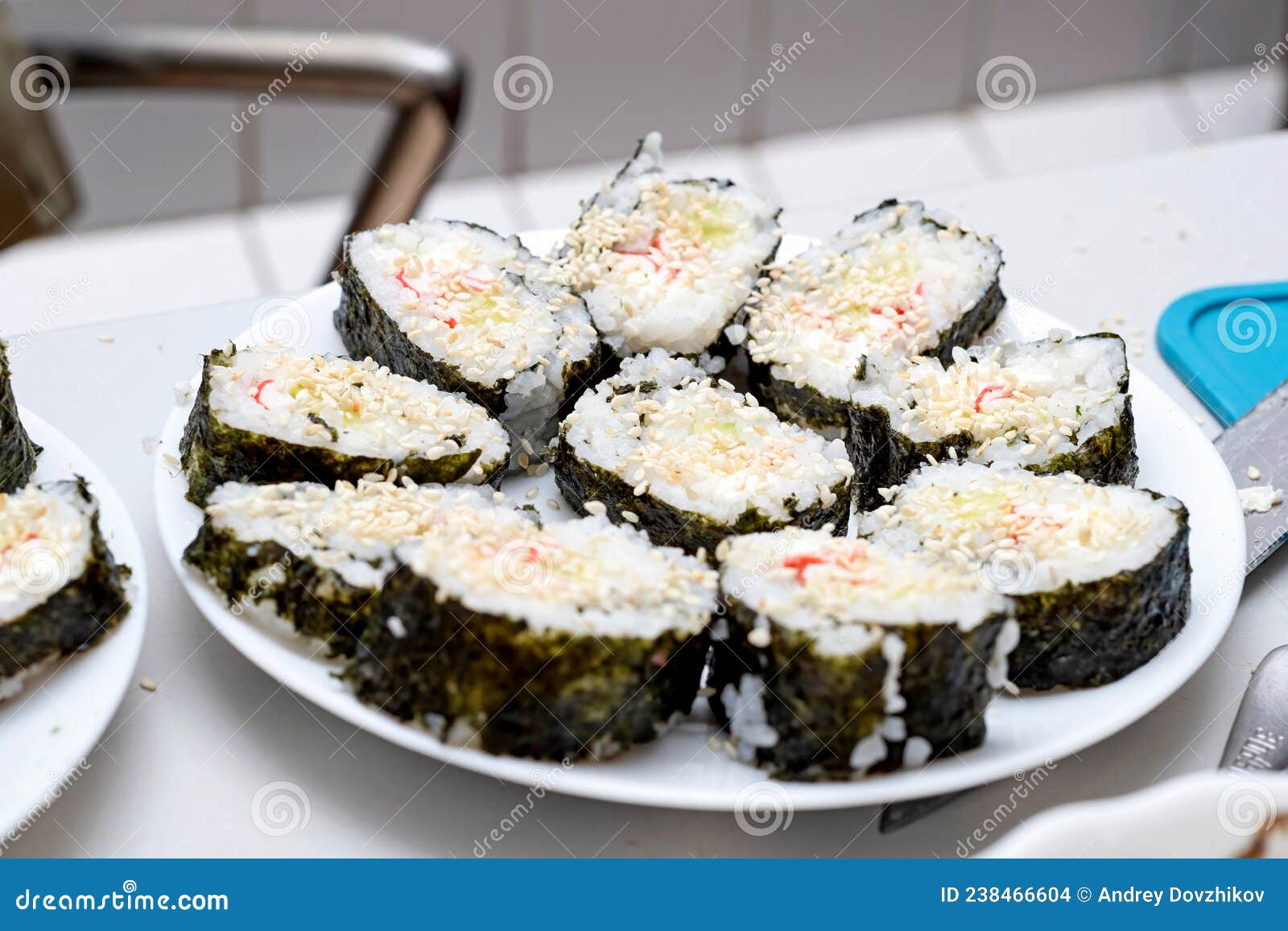 Homemade Sushi, Cut into Pieces, are on the Plates Stock Photo - Image ...